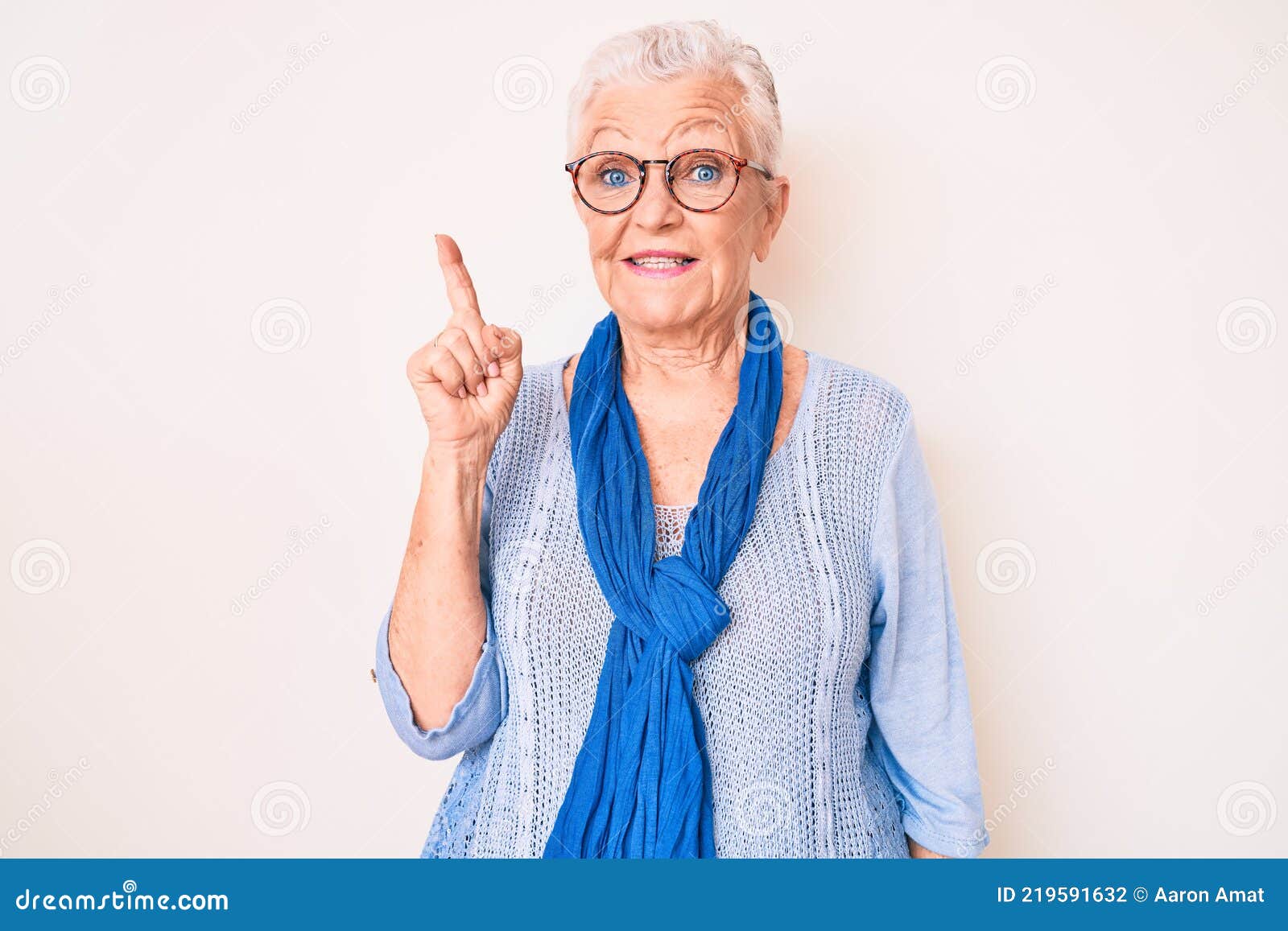 Senior Beautiful Woman With Blue Eyes And Grey Hair Wearing Casual