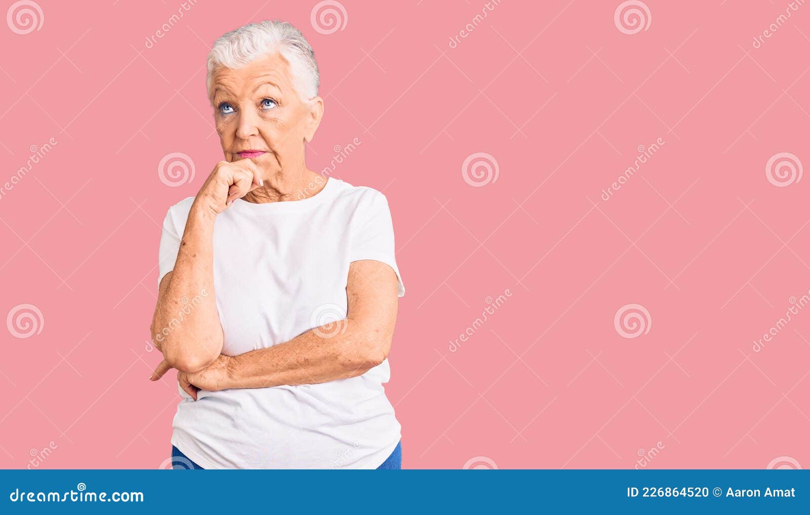 Senior Beautiful Woman With Blue Eyes And Grey Hair Wearing Casual