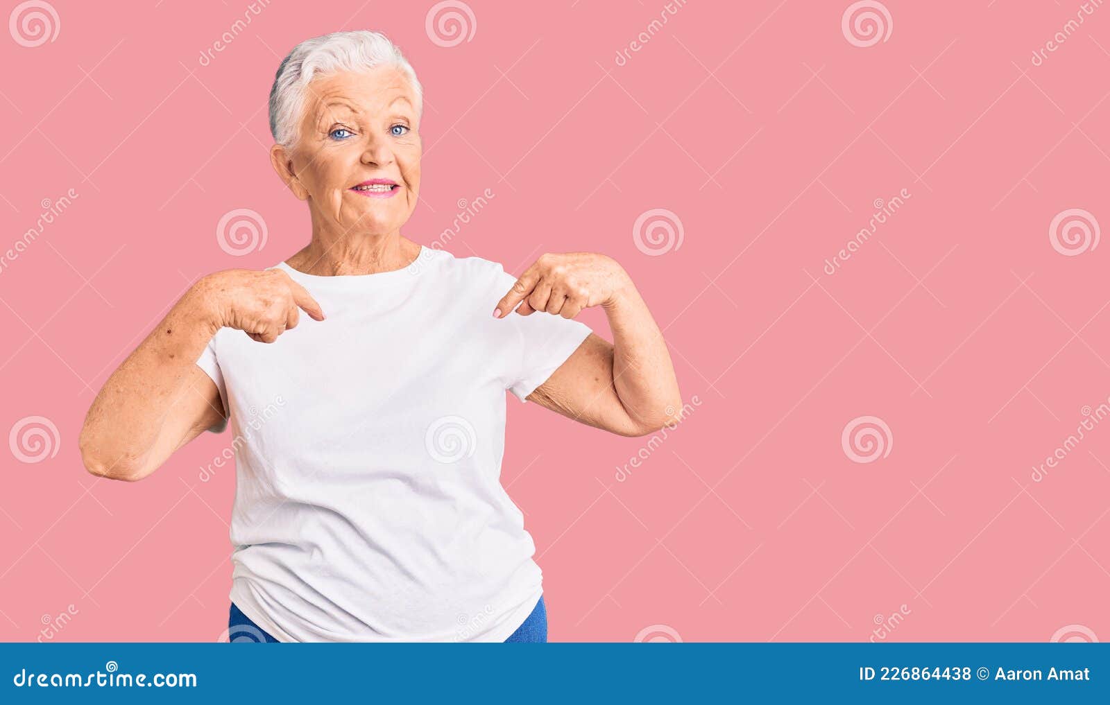 Senior Beautiful Woman With Blue Eyes And Grey Hair Wearing Casual