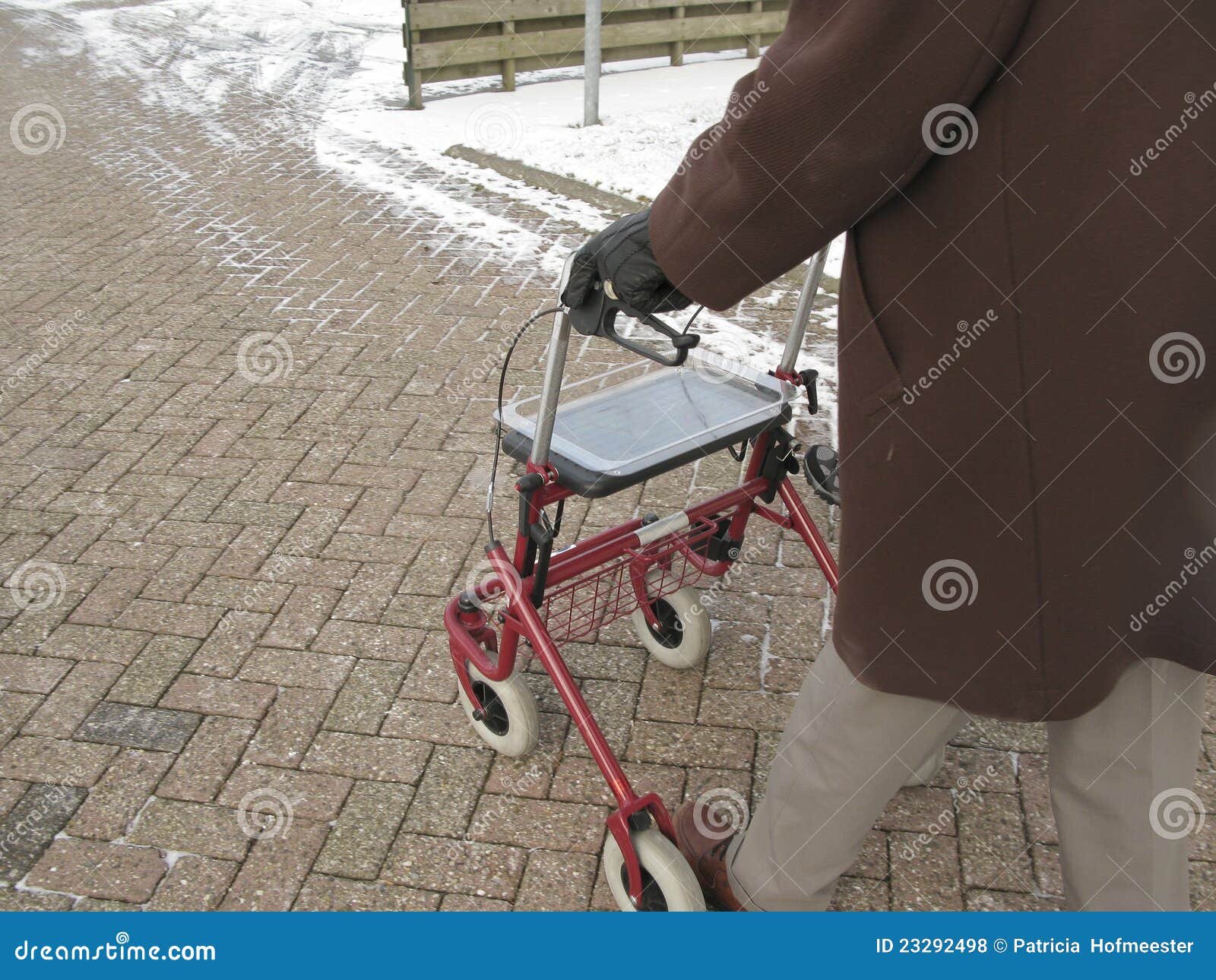 Senior Behind Wheeled Walker in Snow Stock Photo - Image of wheeled ...