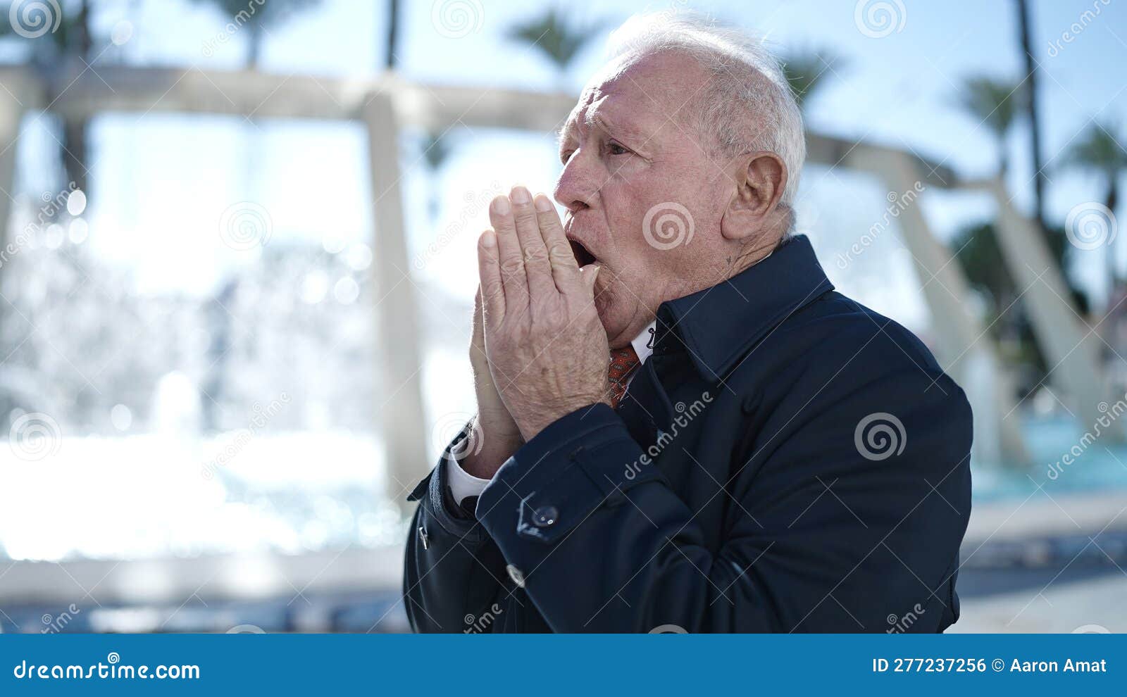 Senior Blowing Air on Hands for Cold at Street Stock Photo - Image of ...