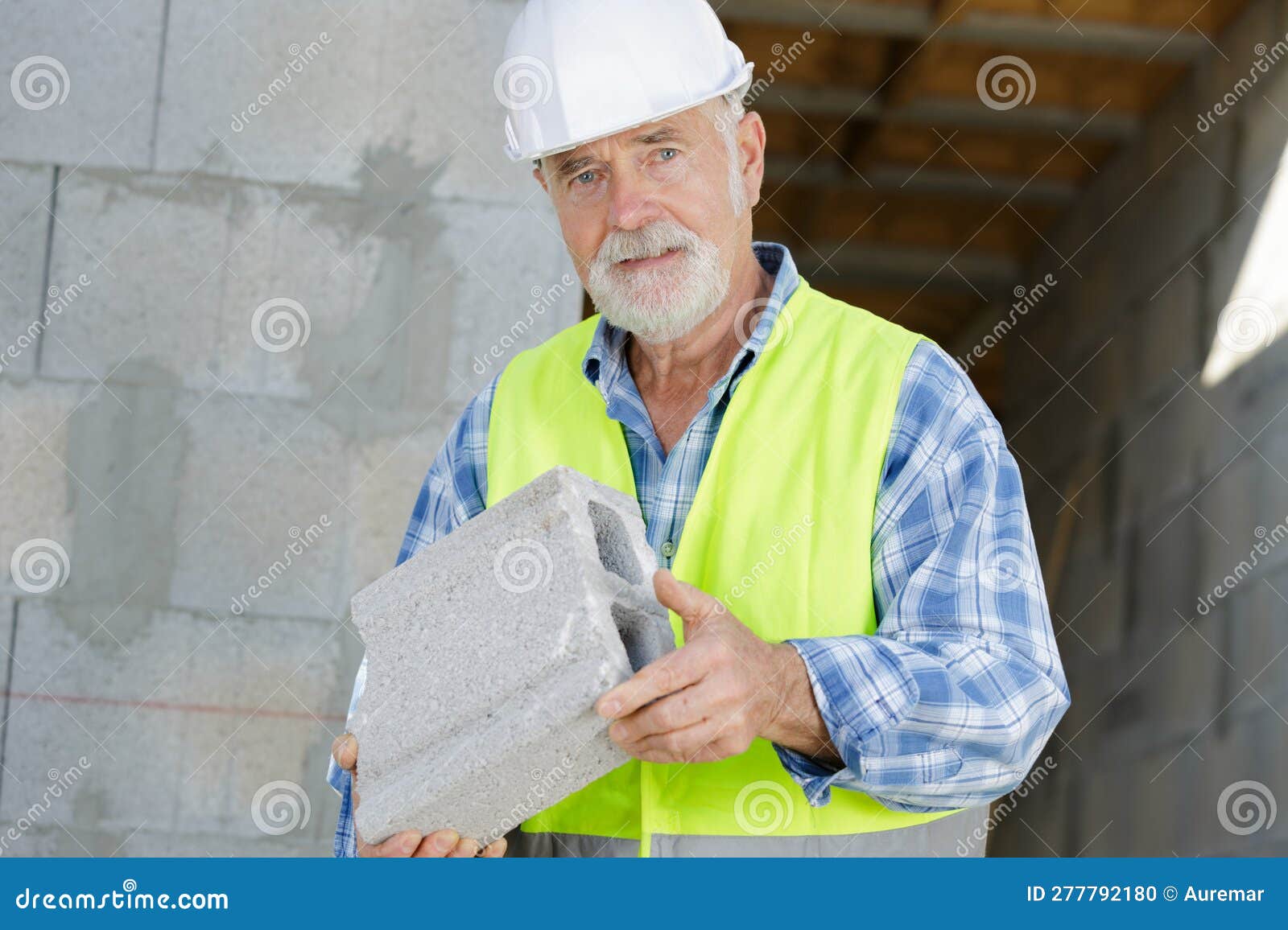 Senior Builder Holding Brick Stock Photo - Image of outdoor, working ...