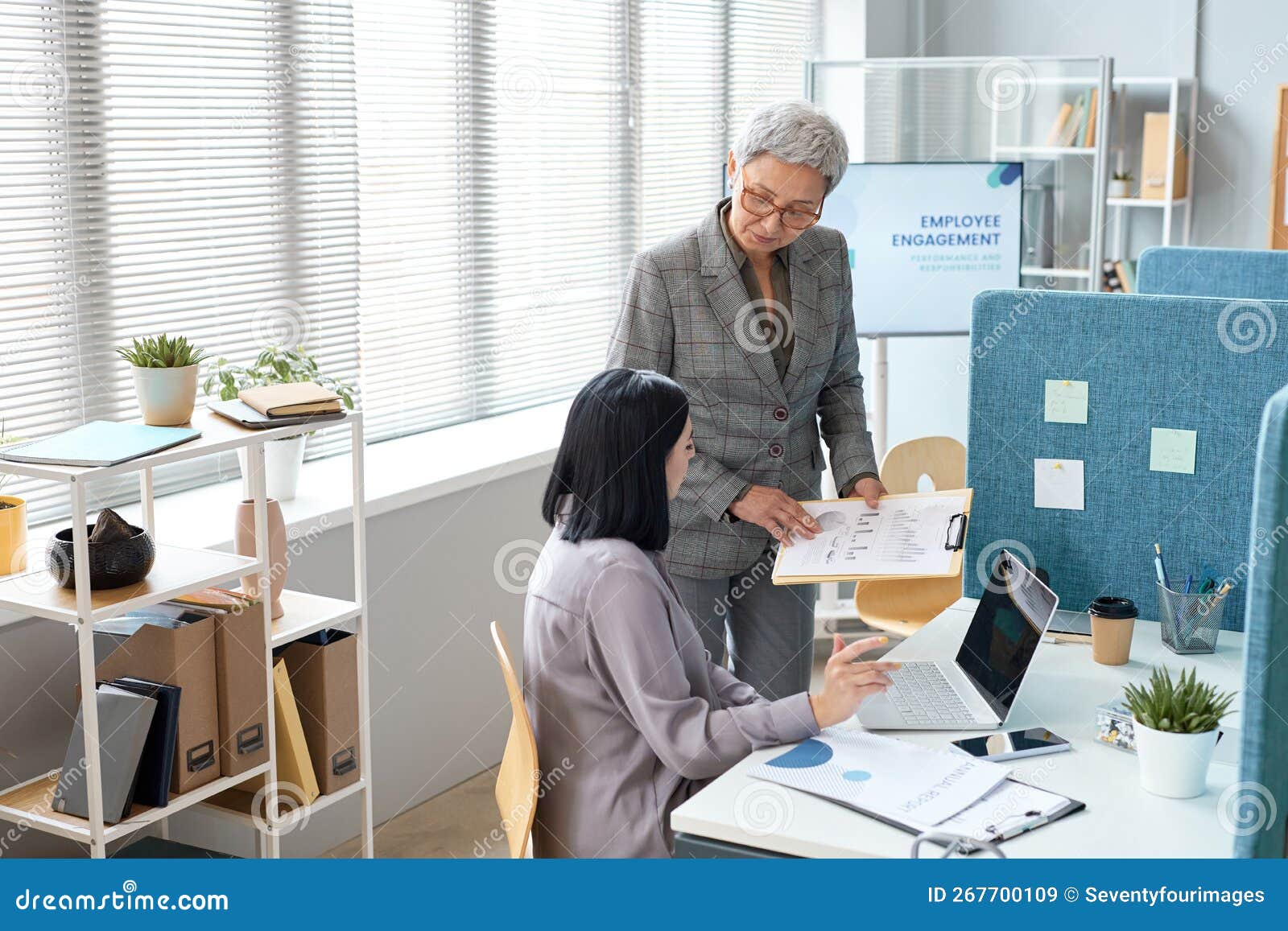 Senior Business Manager Instructing Employees in Office Setting Stock ...