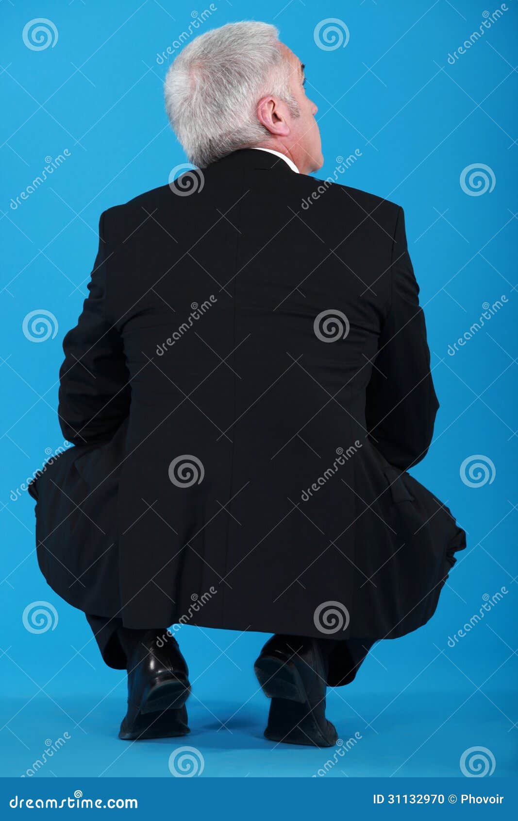 Senior Businessman Crouching Stock Photo - Image of looking, adult ...