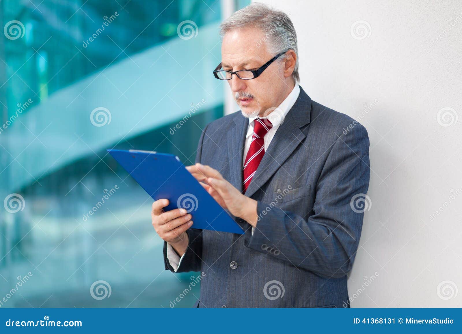 Senior Businessman Reading a Document Stock Image - Image of male ...
