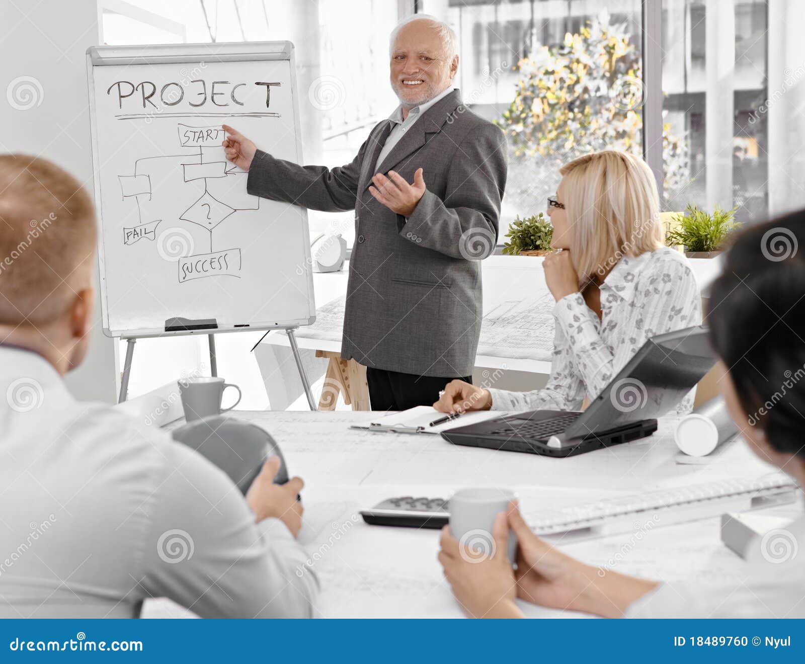 Senior Businessman Talking To Colleagues Stock Photo - Image of ...