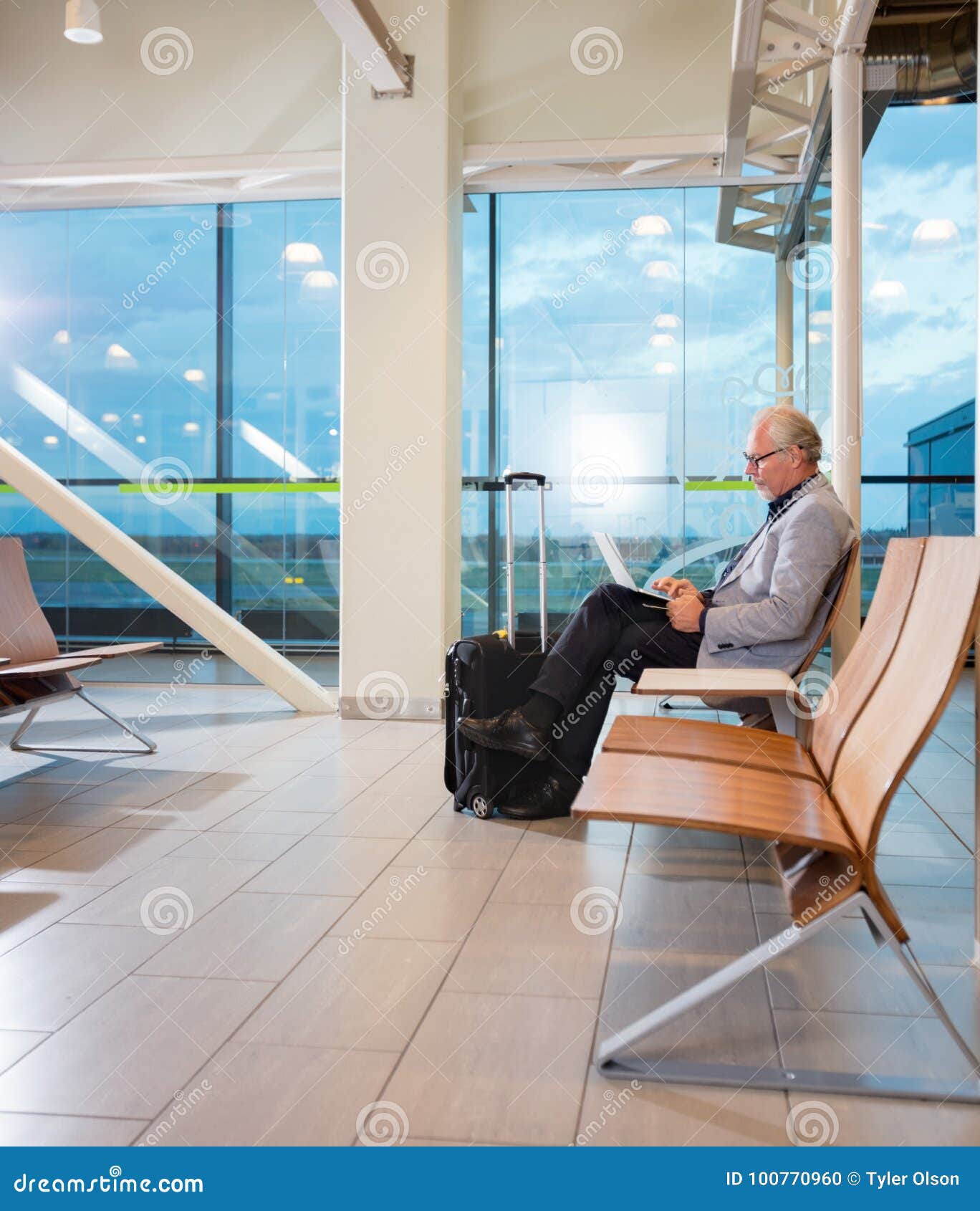 Senior Businessman Using Laptop at Airport Terminal Stock Photo - Image ... Senior Businessman Using Laptop at Airport Terminal Stock Photo - Image ...