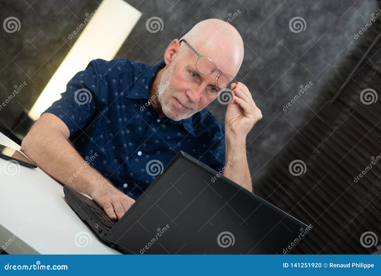 Senior Businessman Using Laptop, he is Having Difficulties and Vision ... Senior Businessman Using Laptop, he is Having Difficulties and Vision ...
