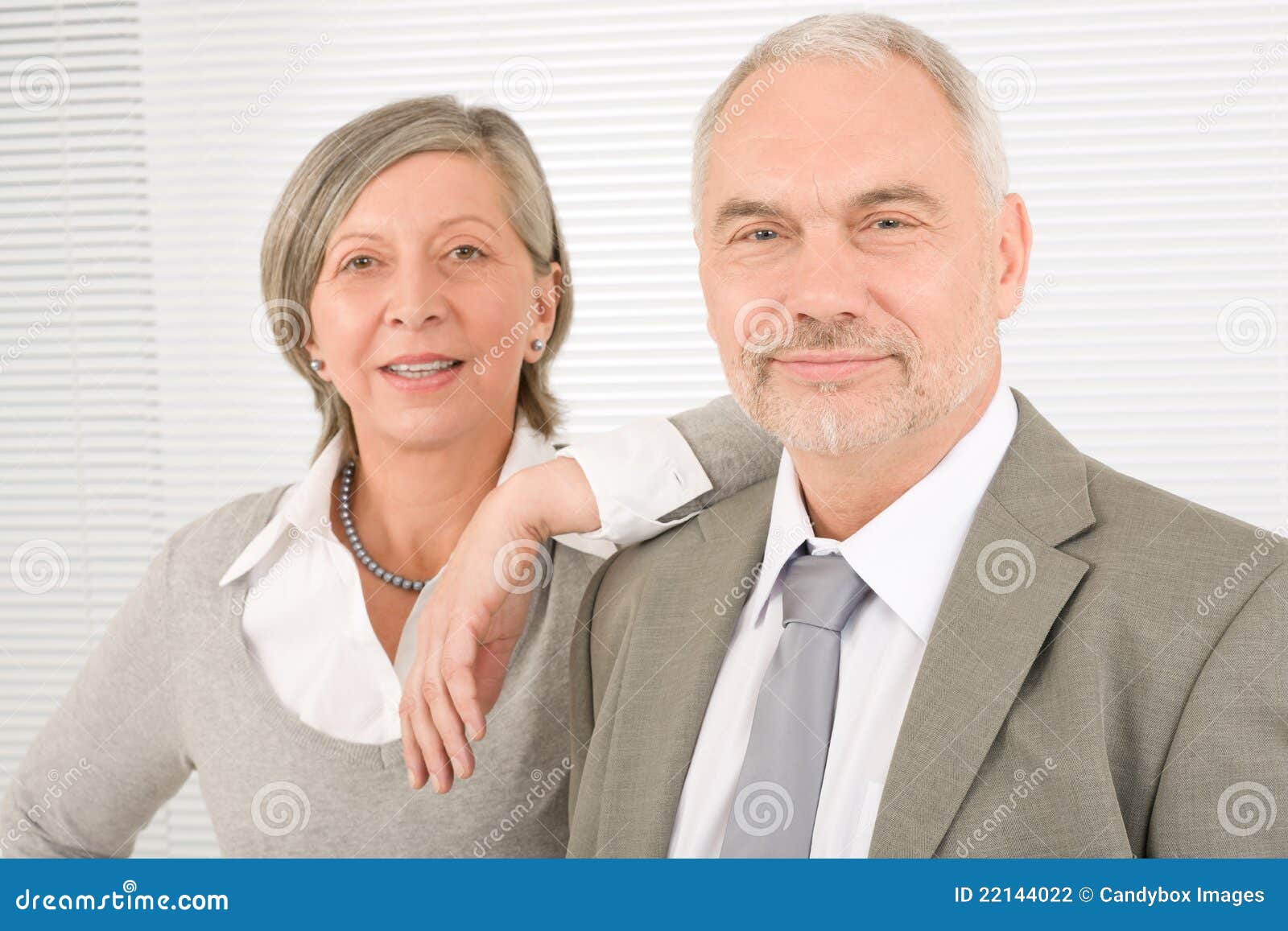 Senior Businesspeople Leaning Over Shoulder Stock Photo - Image of ...