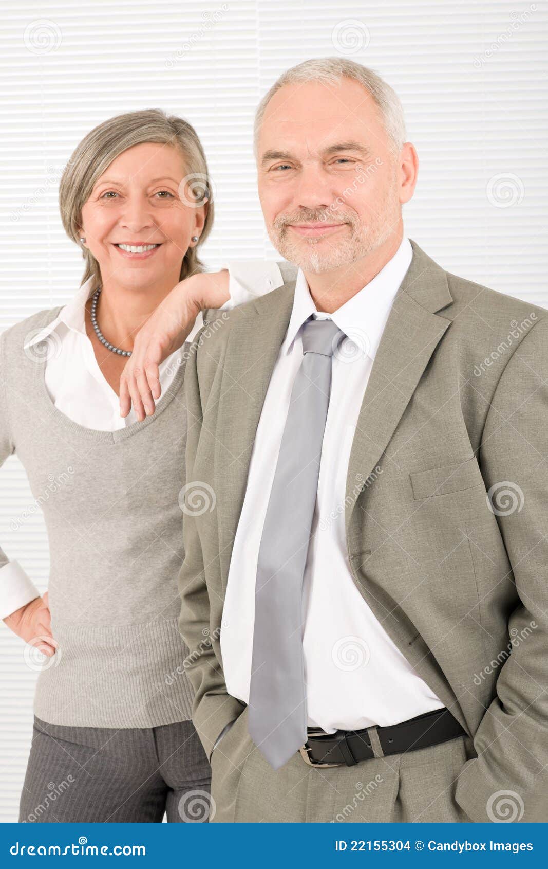 Senior Businesspeople Leaning Over Shoulder Stock Photo - Image of ...