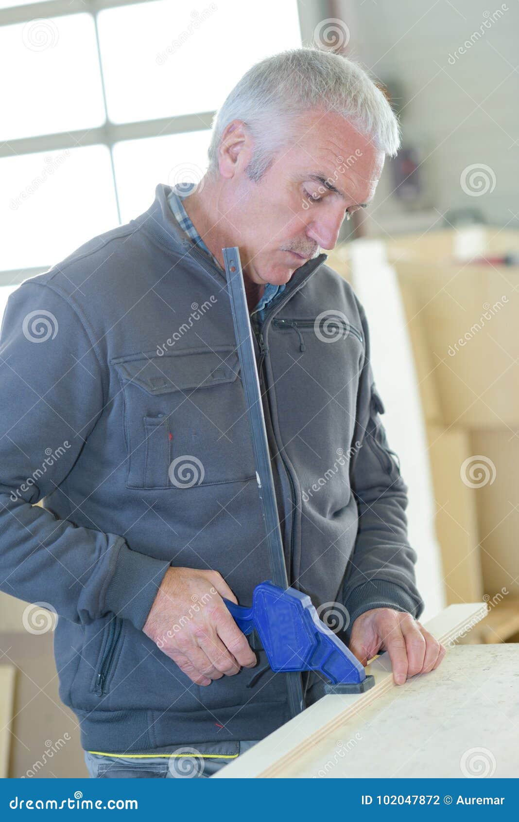 Senior Carpenter Sanding Plank in Workshop Stock Photo - Image of ...