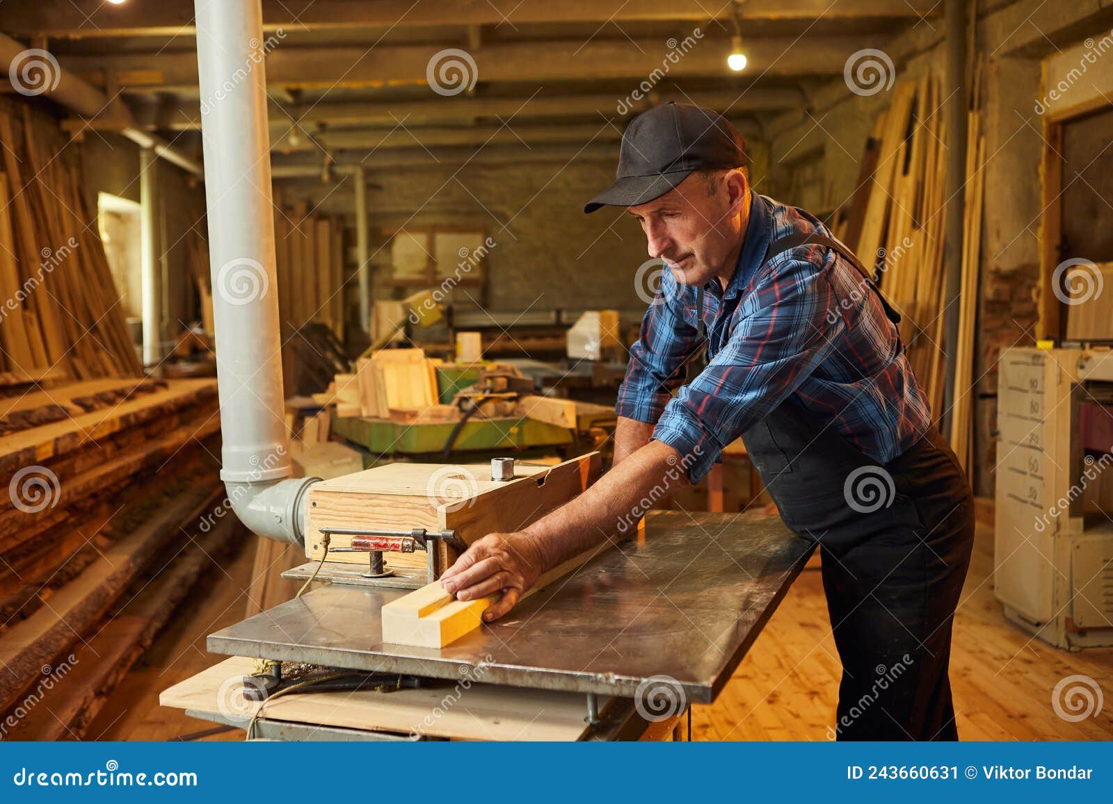 Senior Carpenter in Uniform Works on a Woodworking Machine at the ...