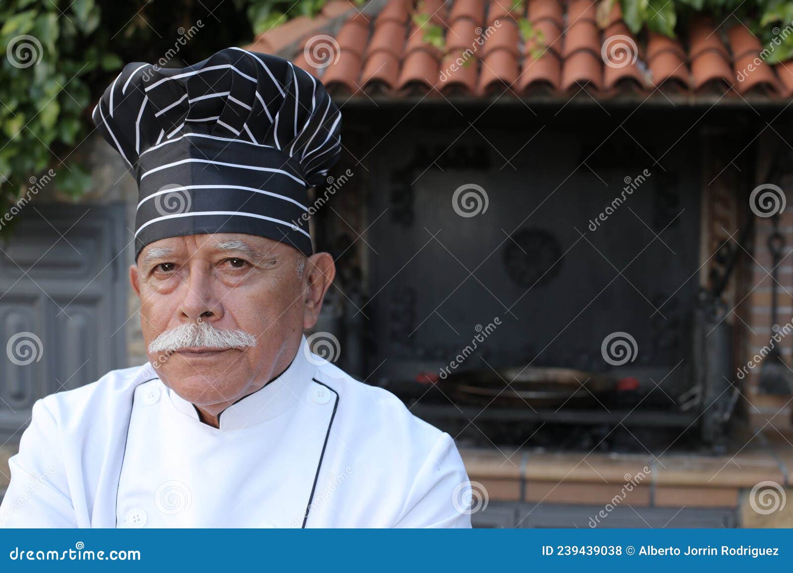 Senior Chef Wearing Traditional Uniform Stock Photo - Image of cooking ...