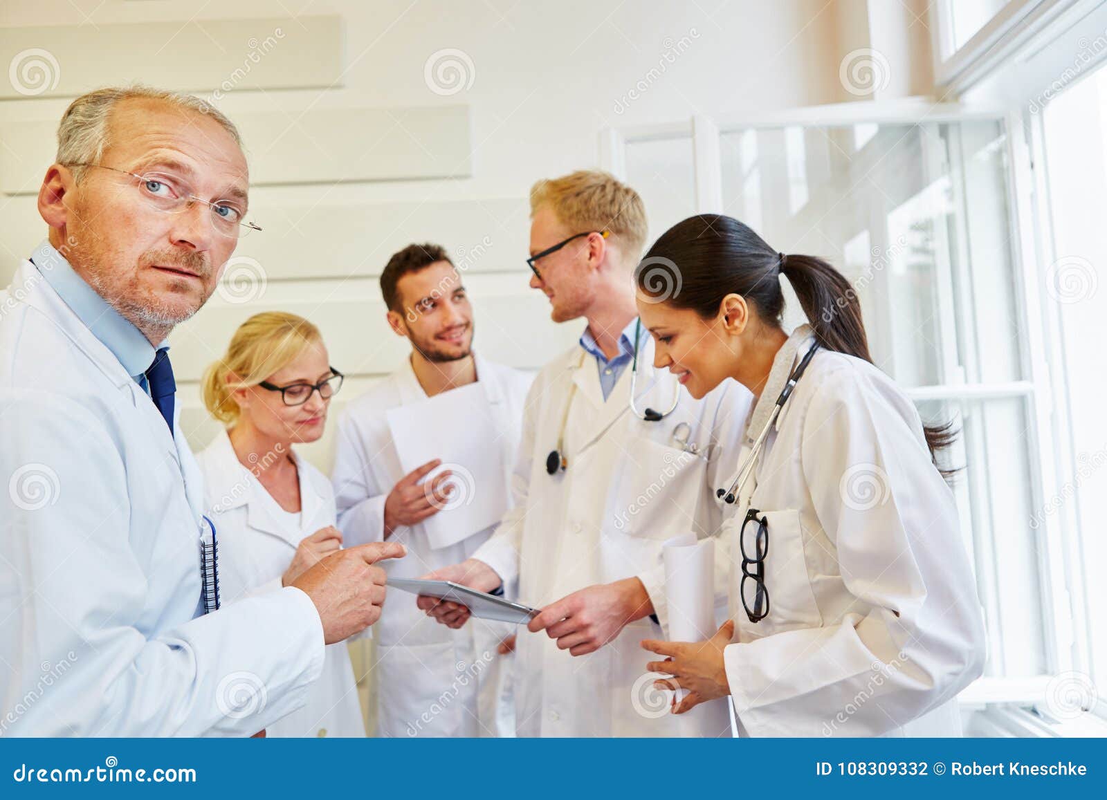 Senior Chief Doctor with Team Stock Photo - Image of technology, staff ...