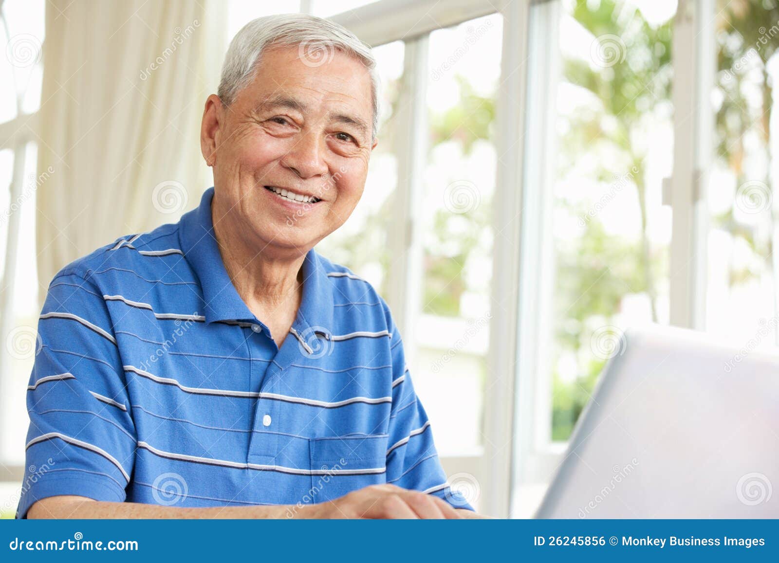 Senior Chinese Man Using a Laptop at Home Stock Photo - Image of happy ...