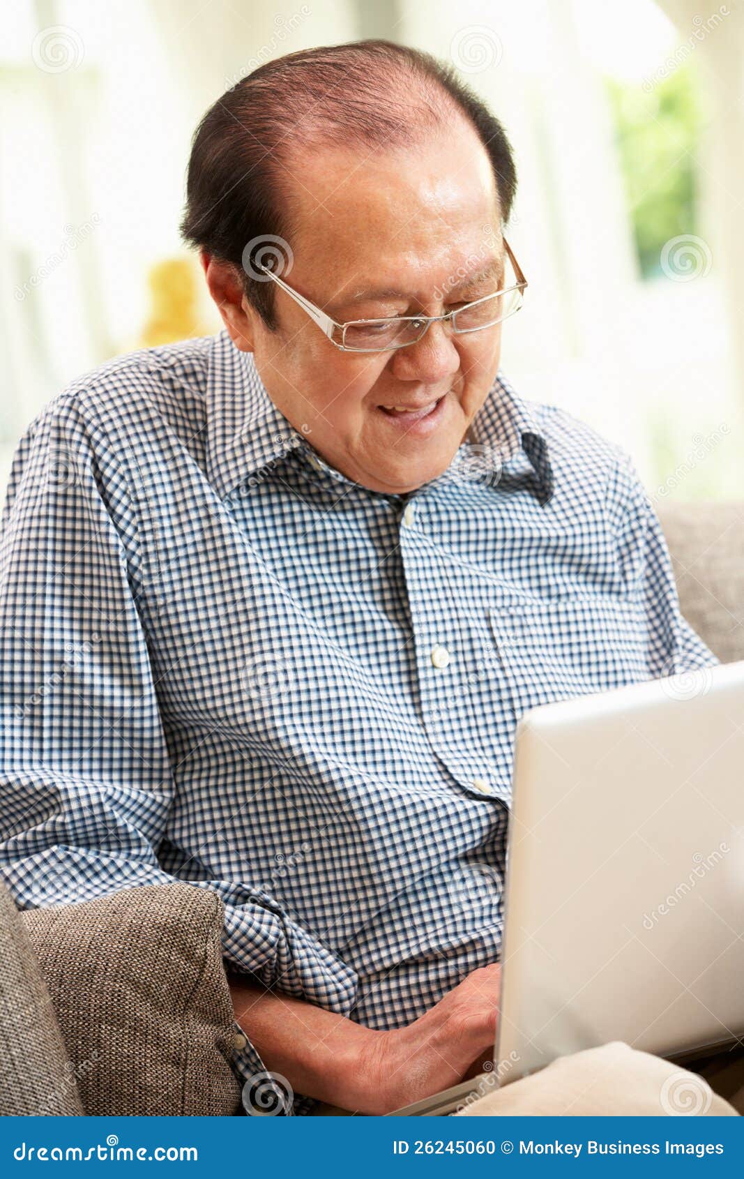 Senior Chinese Man Using Laptop Whilst Relaxing Stock Photo - Image of ...