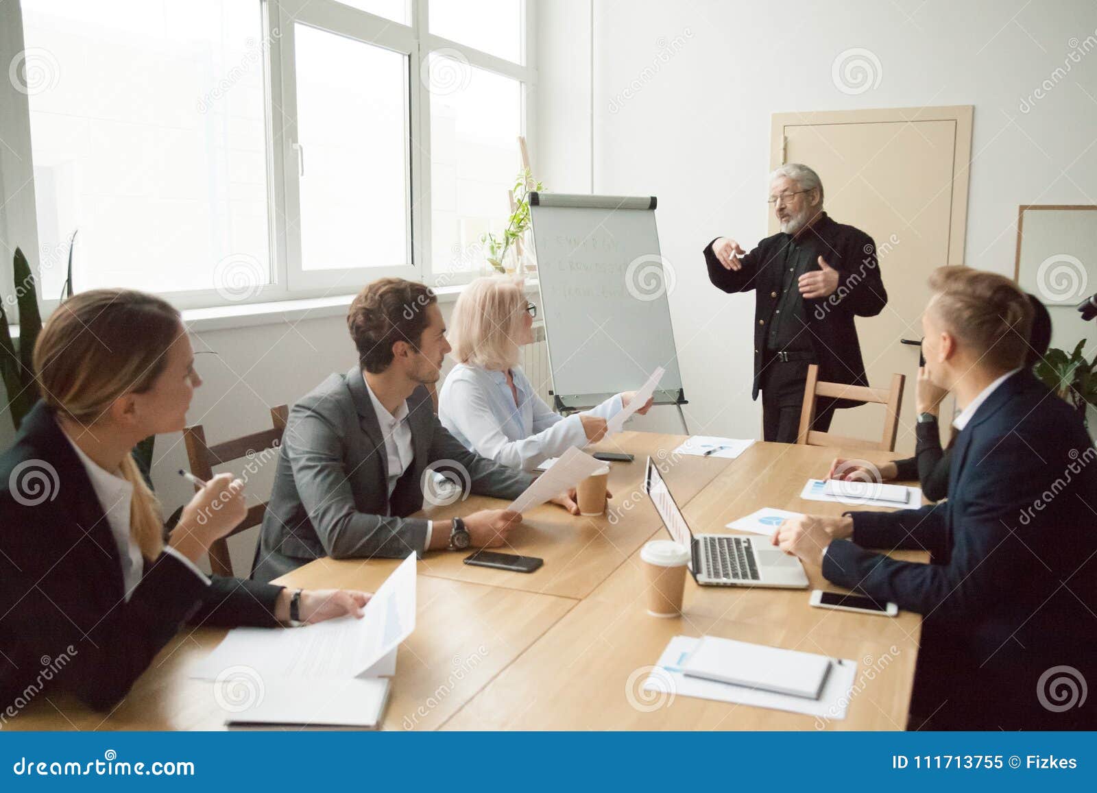 Senior Coach Giving Presentation To Executive Managers Team in B Stock ... Senior Coach Giving Presentation To Executive Managers Team in B Stock ...