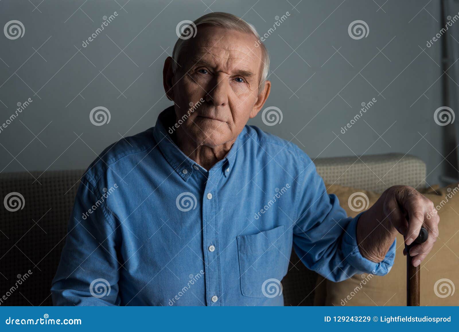 Senior Confident Man Leans on a Cane while Sitting Stock Image - Image ...