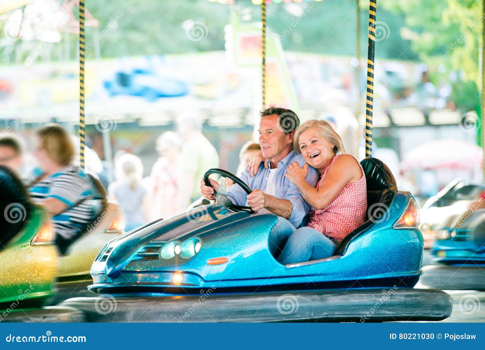 Senior Couple in the Bumper Car at the Fun Fair Stock Photo - Image of ...