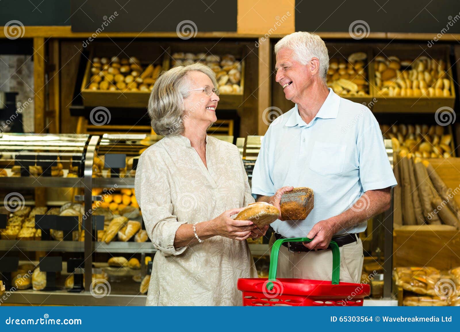 Senior couple buying bread stock photo. Image of buying - 65303564