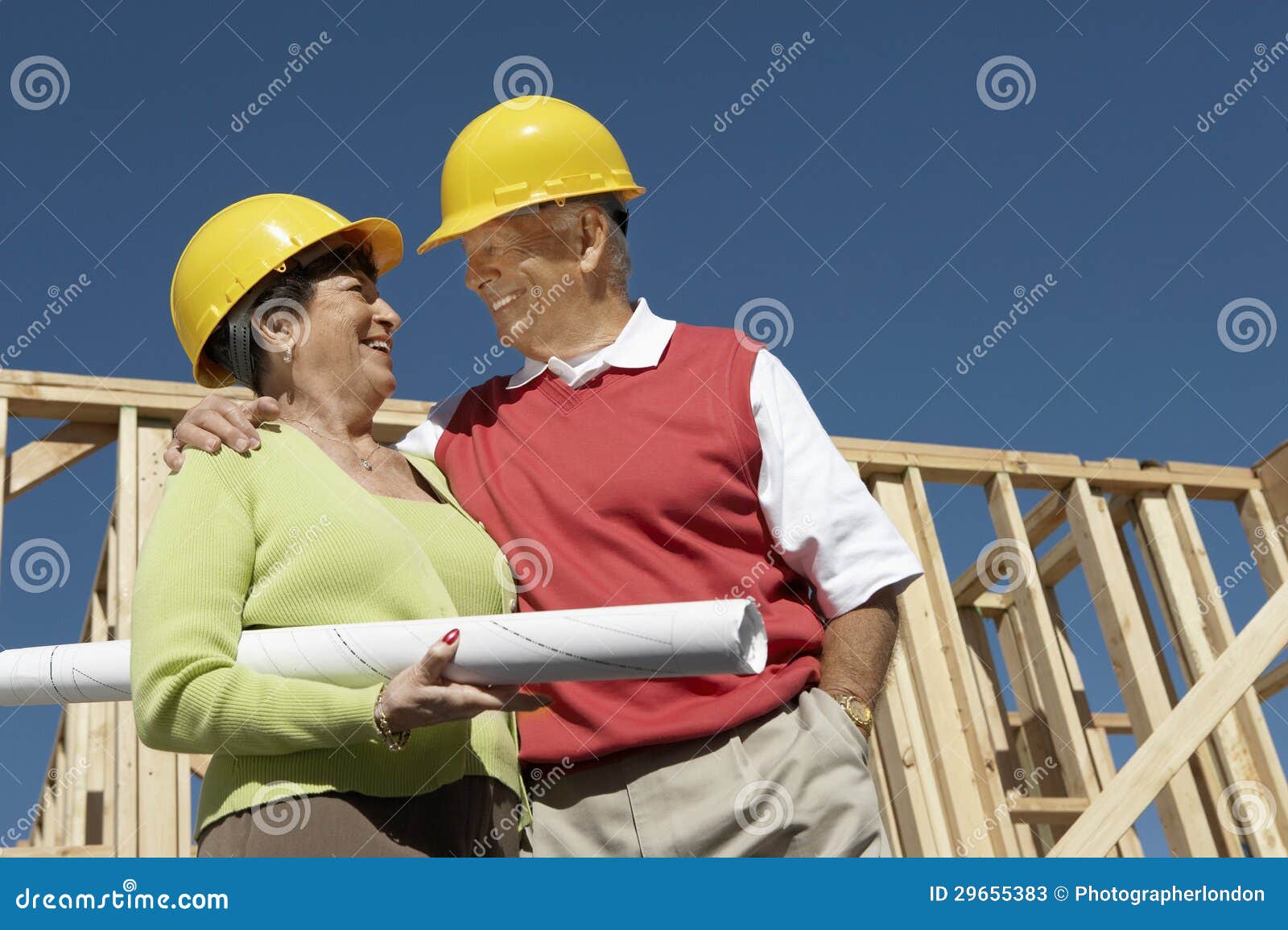 Senior Couple at Construction Site Stock Image - Image of rolled ...