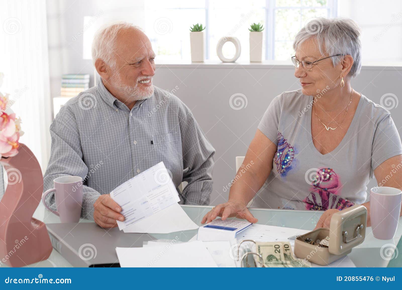 Senior Couple Discussing Finances at Home Stock Photo - Image of happy ...