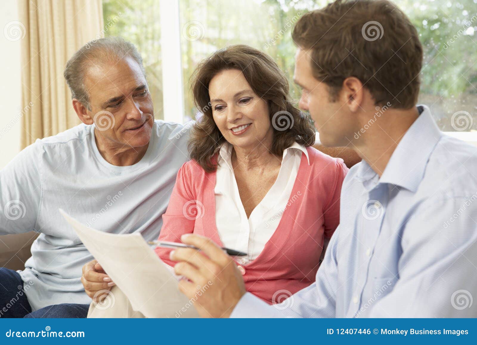 Senior Couple with Financial Advisor Stock Photo - Image of reading ...