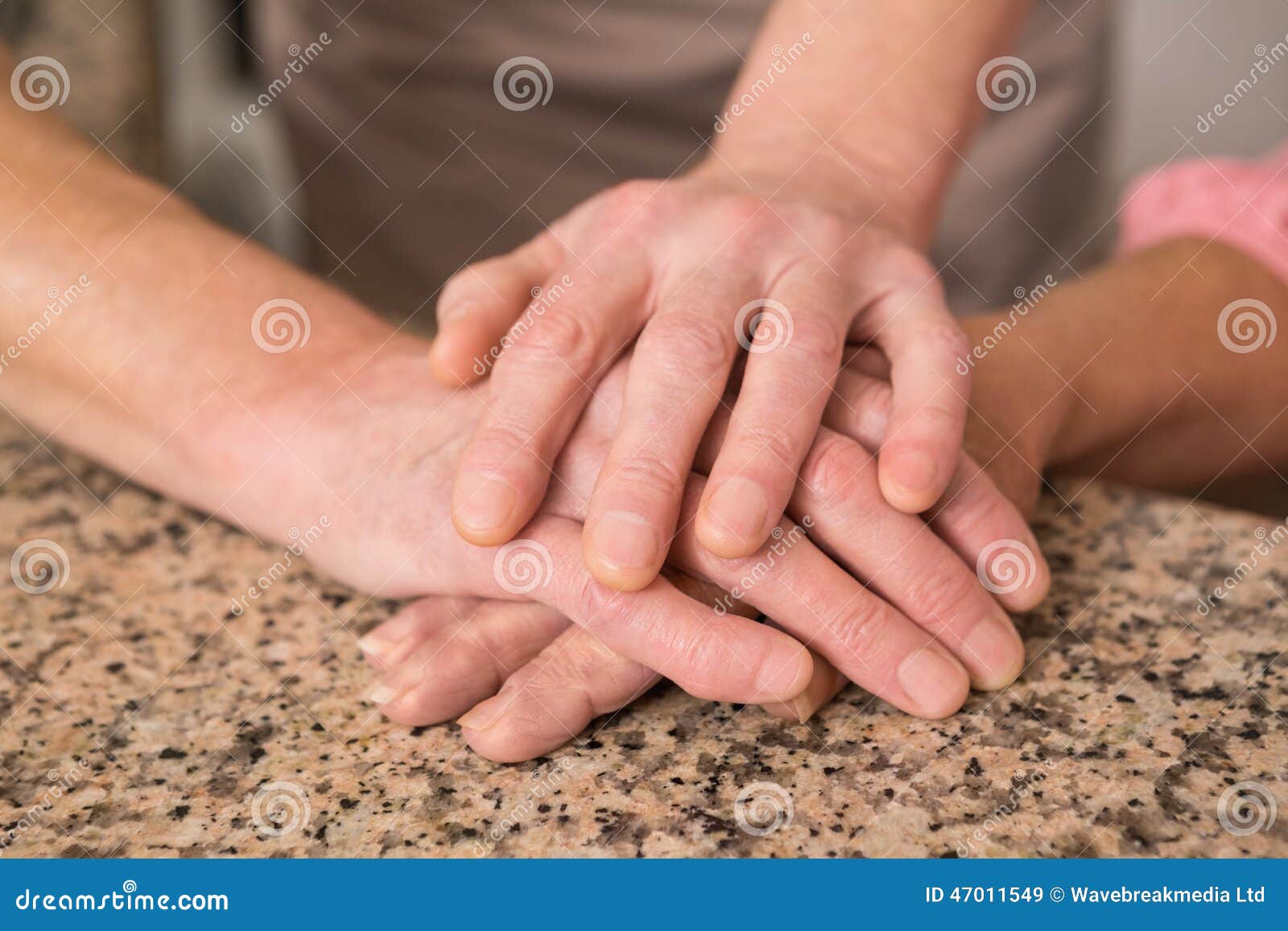 Senior Couple Holding Hands on Table Stock Image - Image of home ...