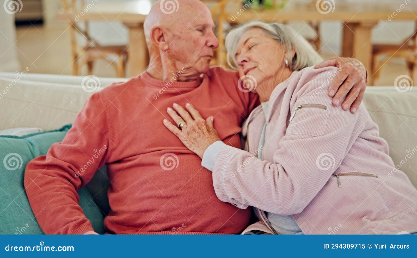Senior Couple Hug And Home With Forehead Kiss Support And Care On A
