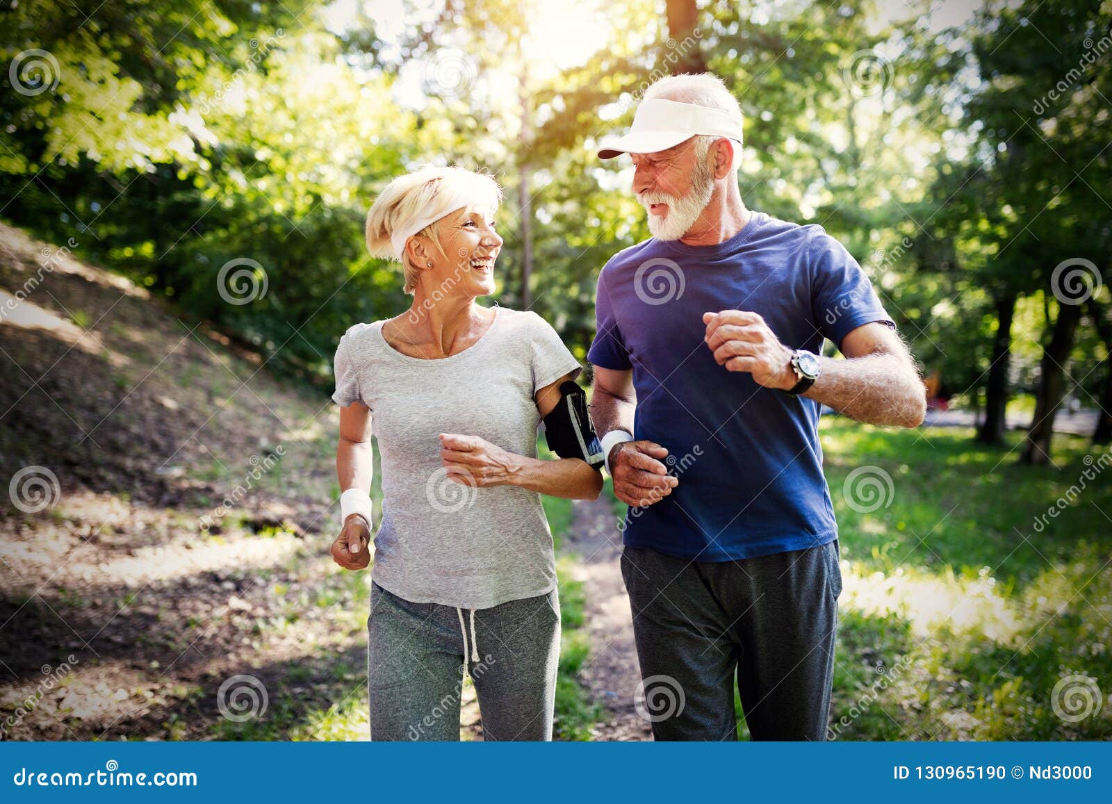 Senior Couple Jogging and Running Outdoors in Nature Stock Photo ...