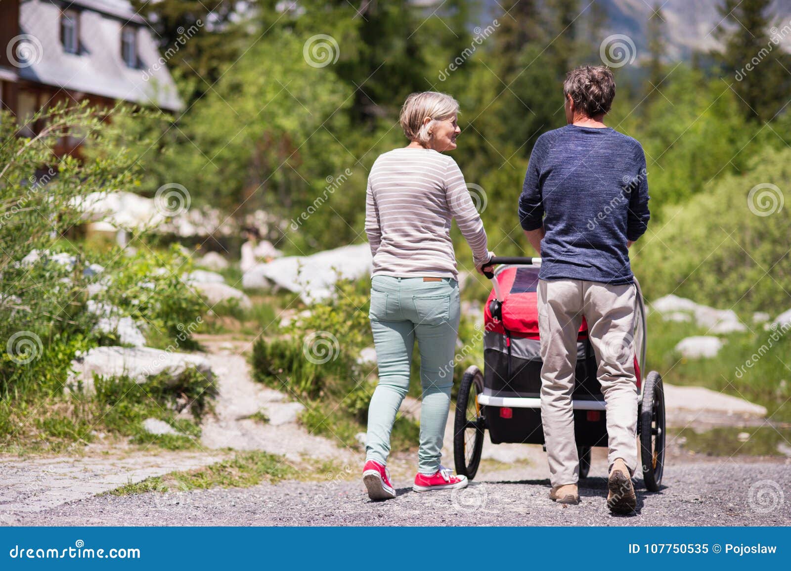 Senior Couple with a Jogging Stroller, Summer Day. Stock Image - Image ...