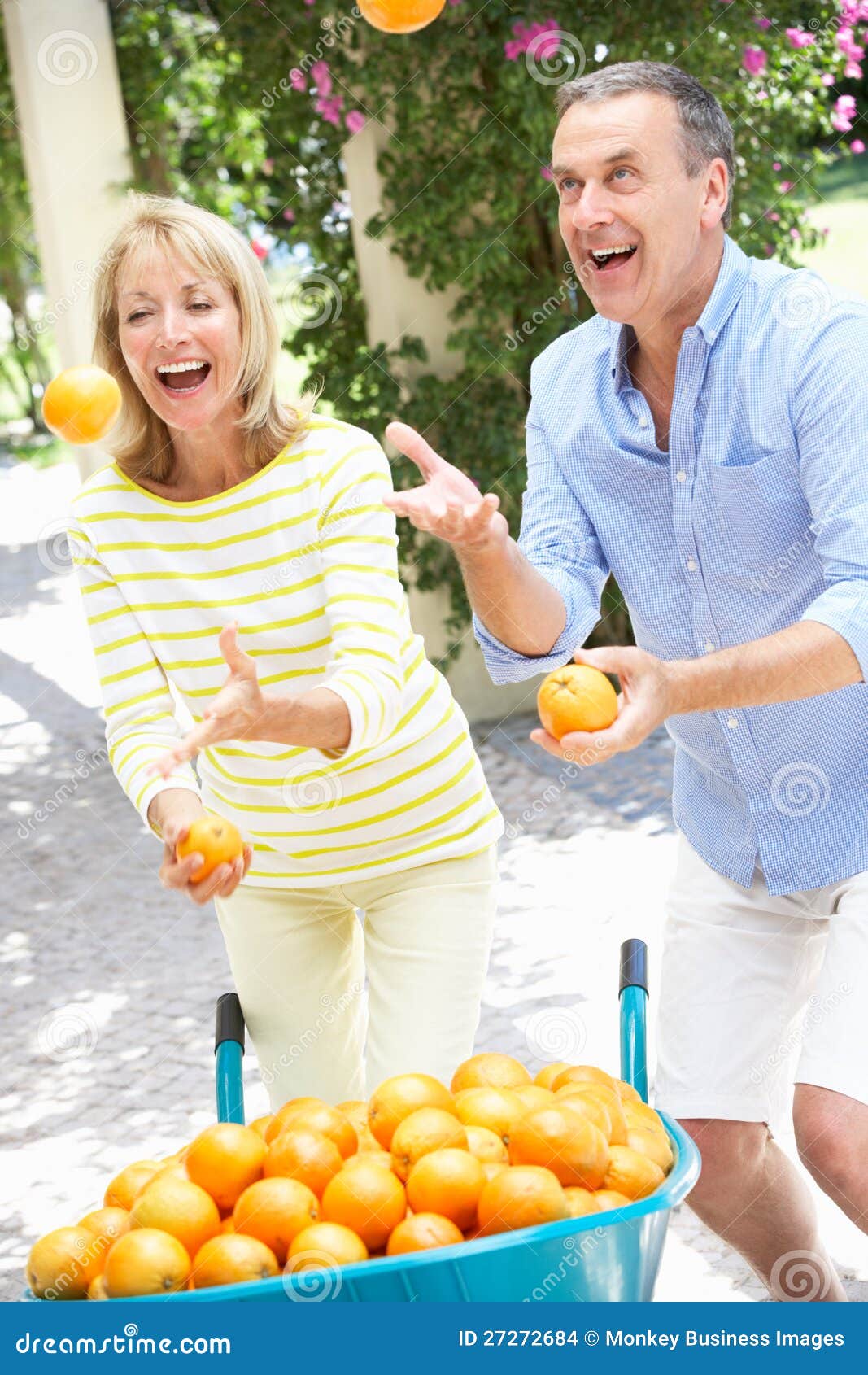 Senior Couple Juggling Oranges Stock Photo - Image of holiday, vacation ...