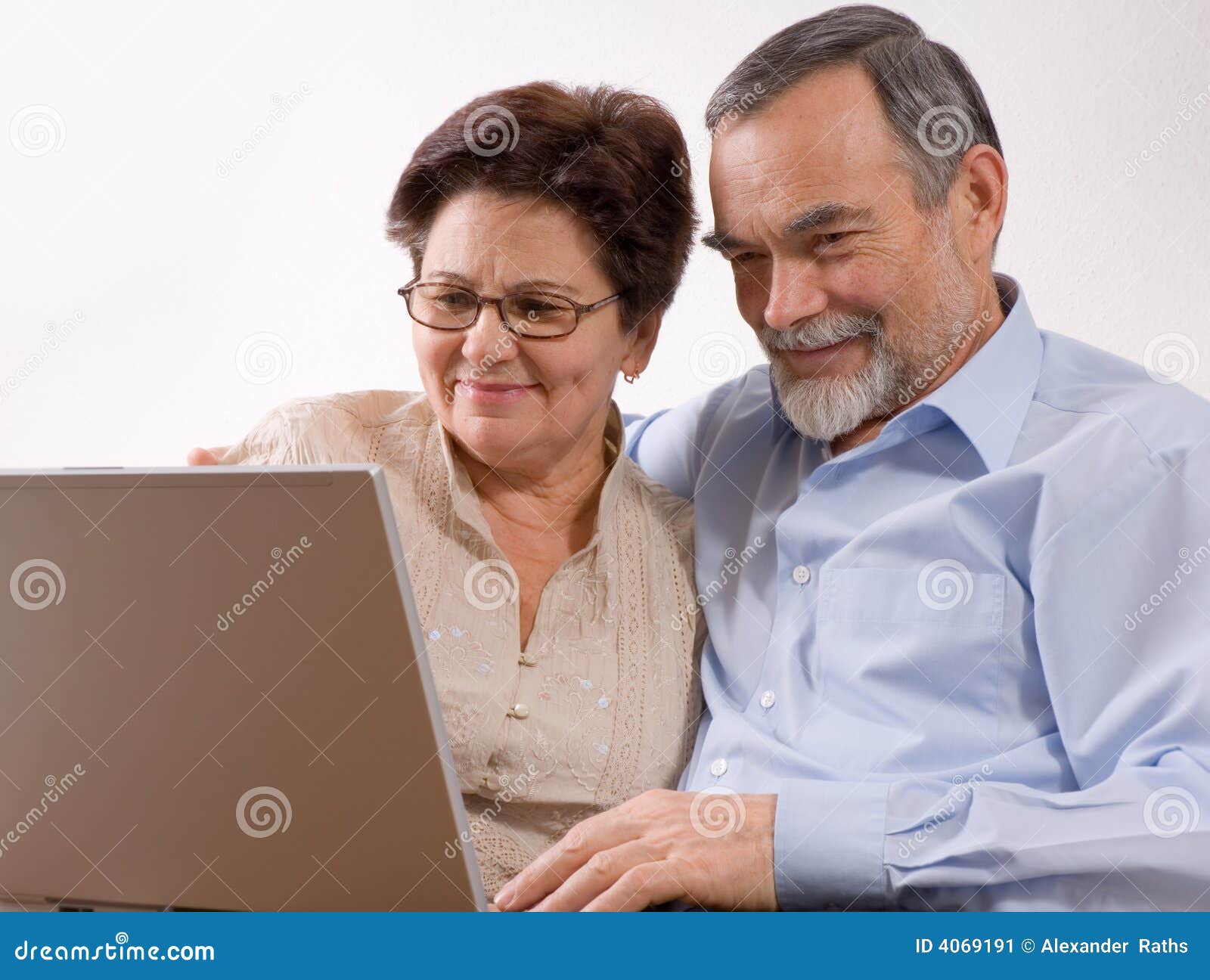 Senior couple on laptop stock image. Image of computer - 4069191