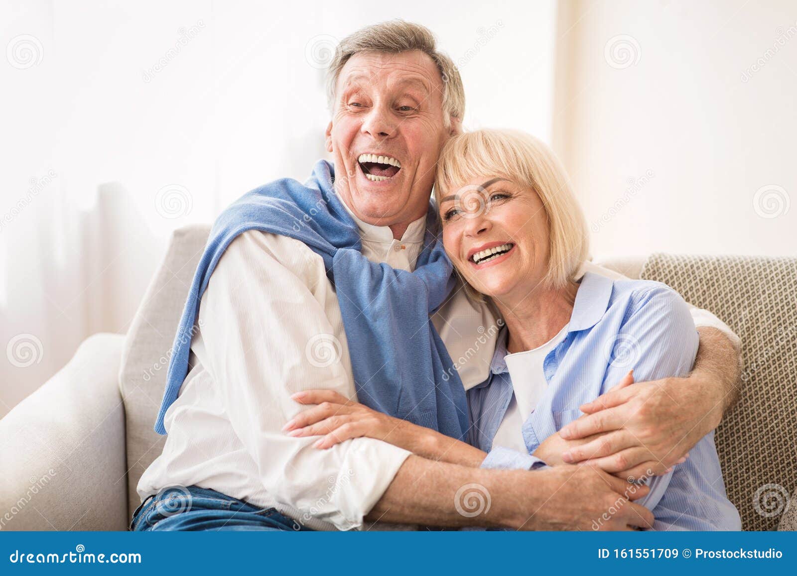 Senior Couple Laughing Together Relaxing At Home Stock Image Image