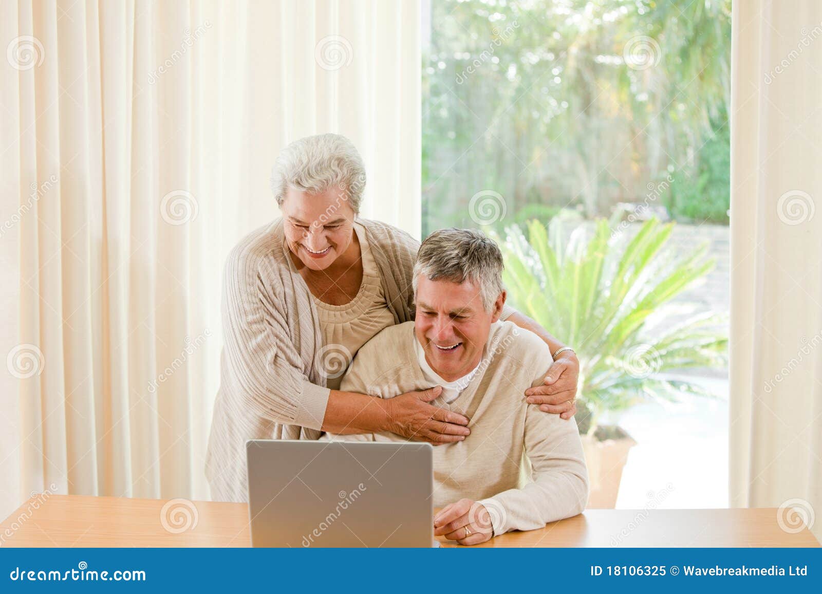 Senior Couple Looking at Their Laptop Stock Image - Image of people ...