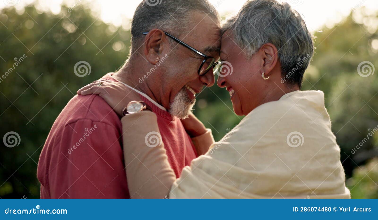 Senior Couple Love And Forehead Touch In Garden For Hug Care And