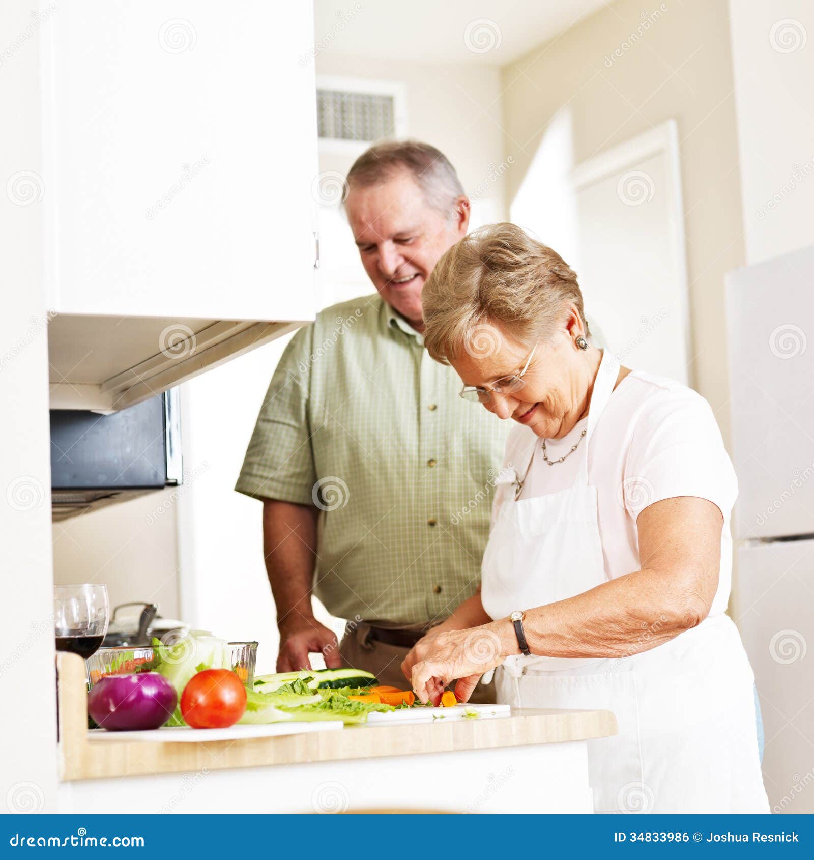 Senior Couple Making Dinner Stock Photo - Image of food, kitchen: 34833986