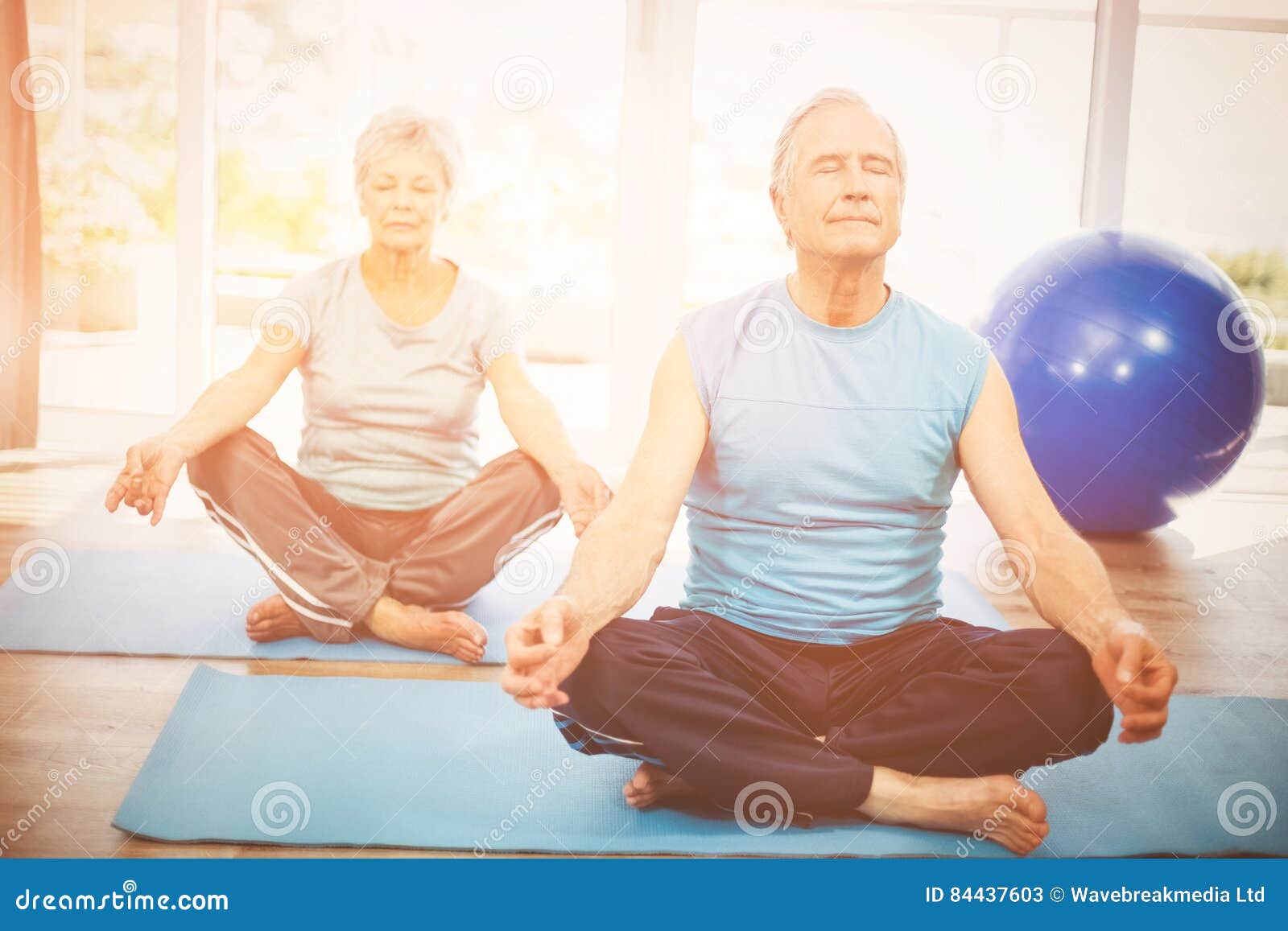 Senior Couple Meditating at Home Stock Image - Image of fitness ...