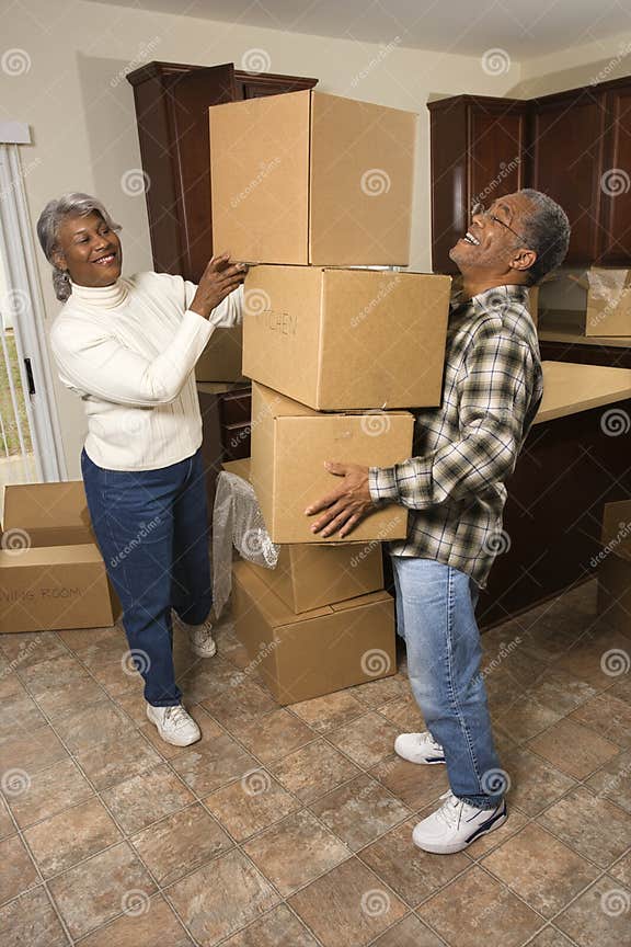 Senior Couple with Moving Boxes Stock Image - Image of full, indoors ...