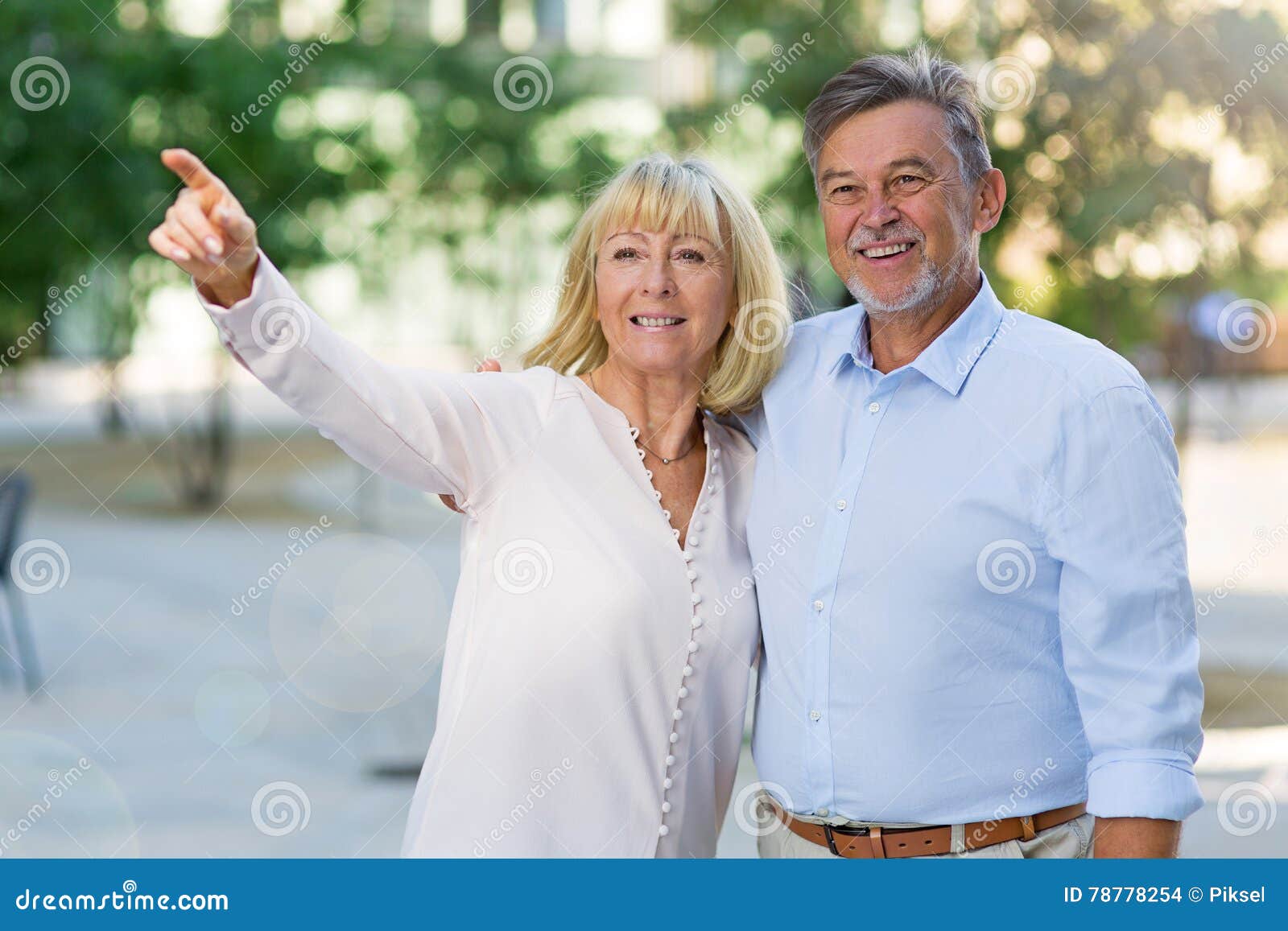 Senior couple pointing stock photo. Image of pensioner - 78778254