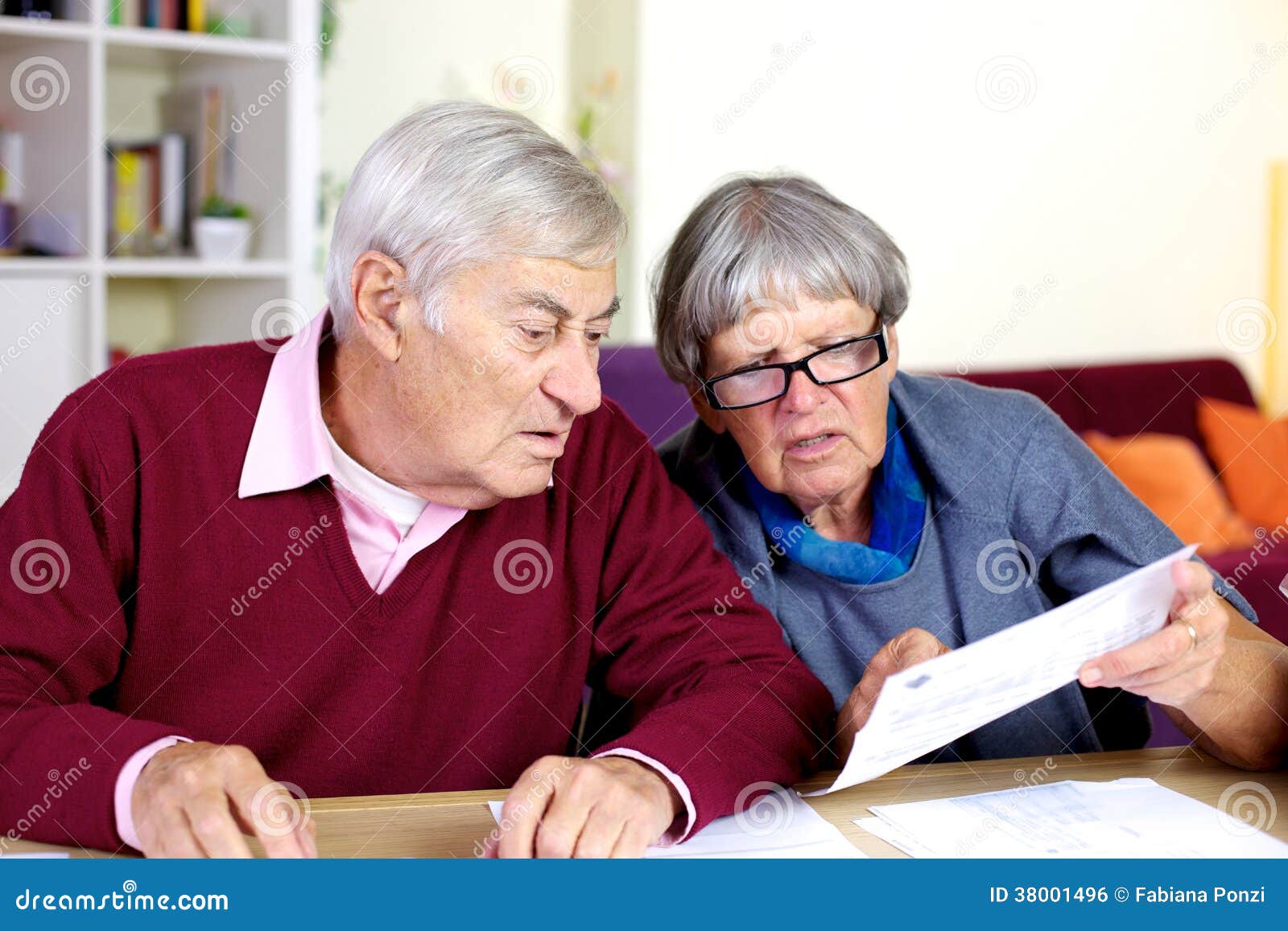 Senior Couple Reading Bills at Home Stock Photo - Image of handsome ...