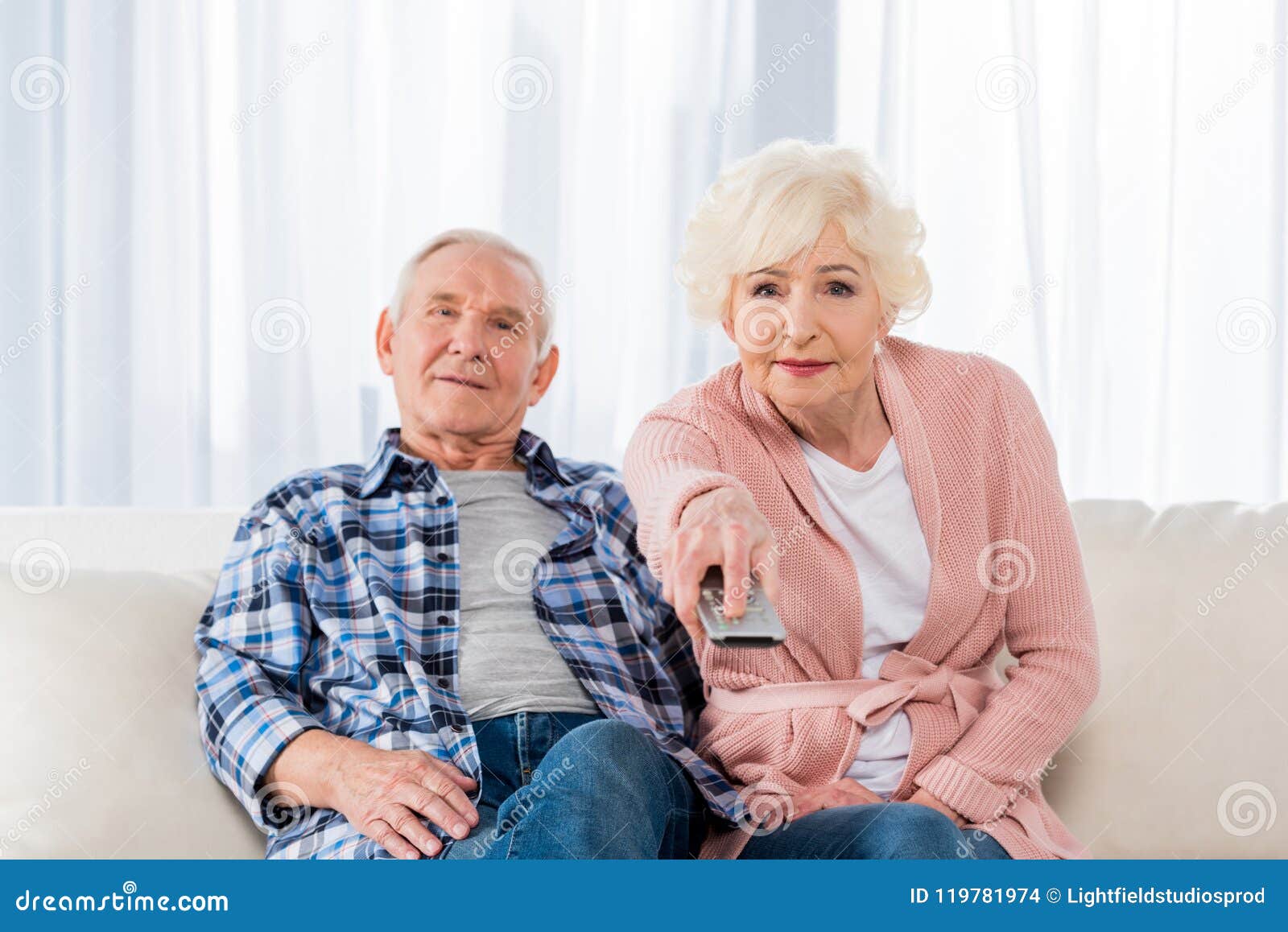 Senior Couple with Remote Control Watching Tv Stock Photo - Image of ...