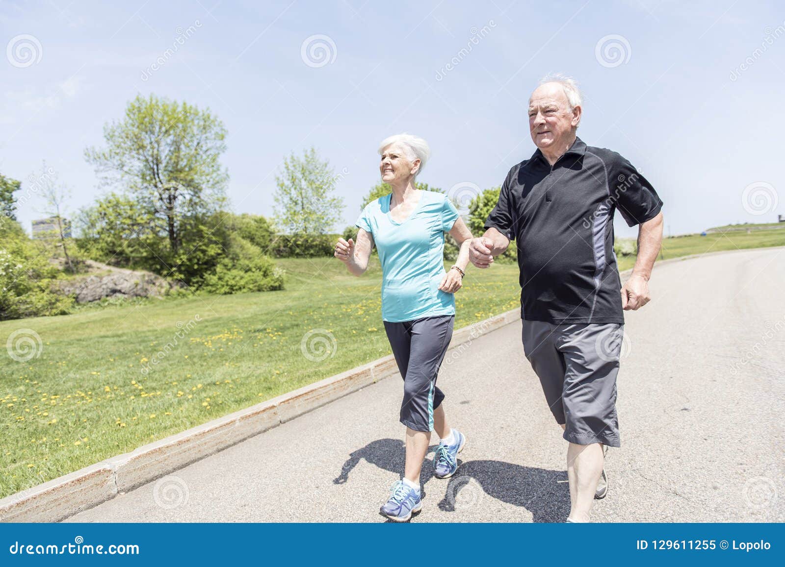 Senior Couple Running in Park Stock Image - Image of outdoors ...