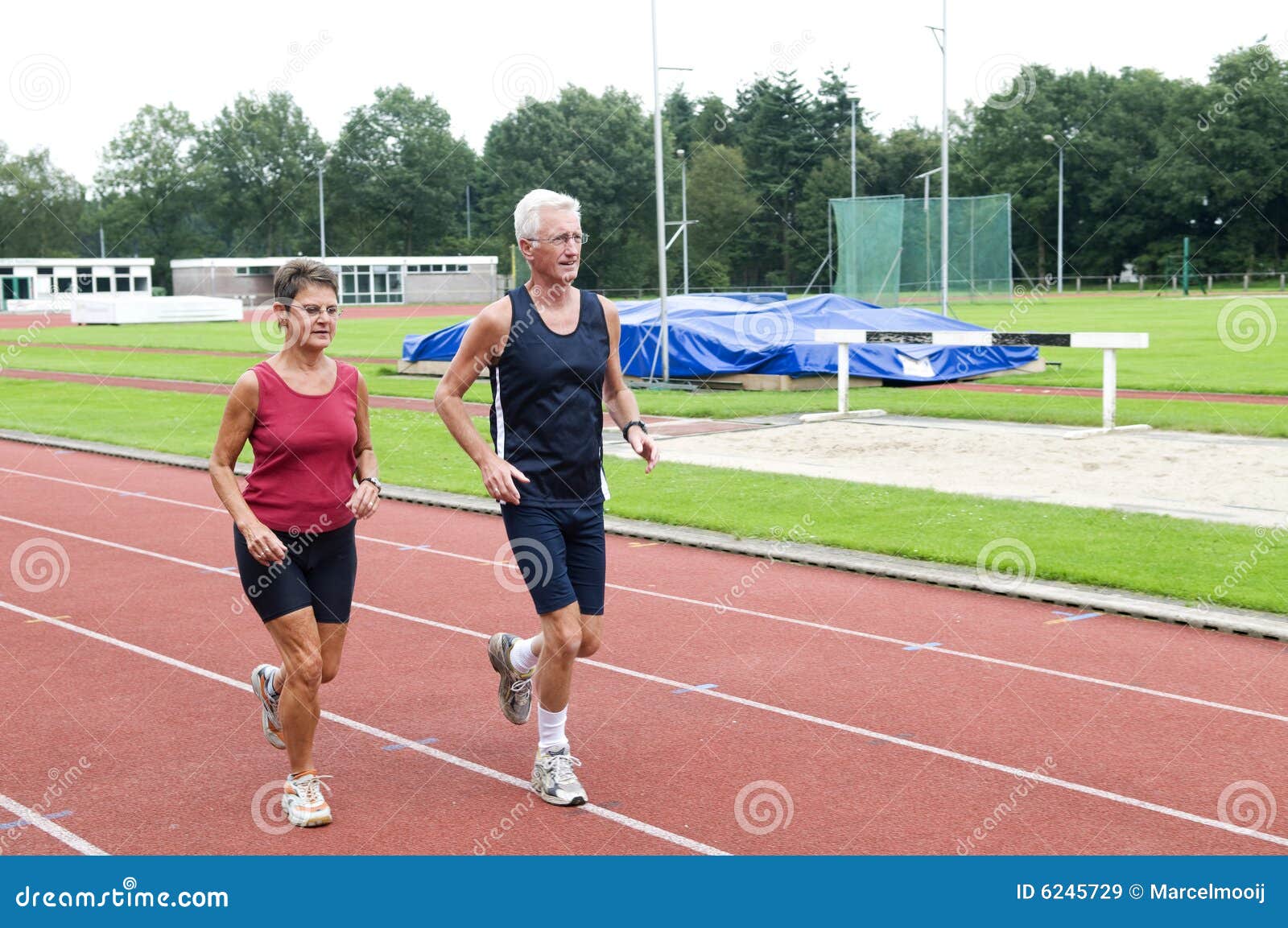 Senior Couple Running on a Track Stock Image - Image of exhausting ...