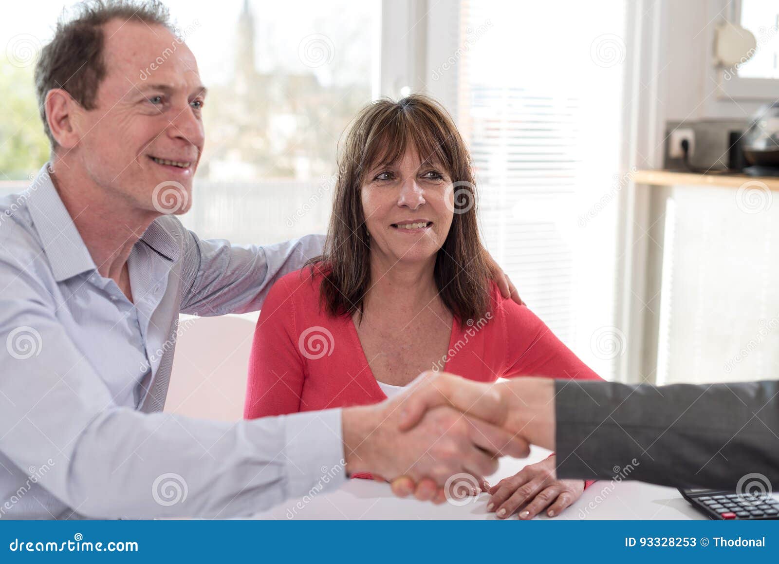 Senior Couple Shaking Hands with Realtor Stock Image - Image of happy ...
