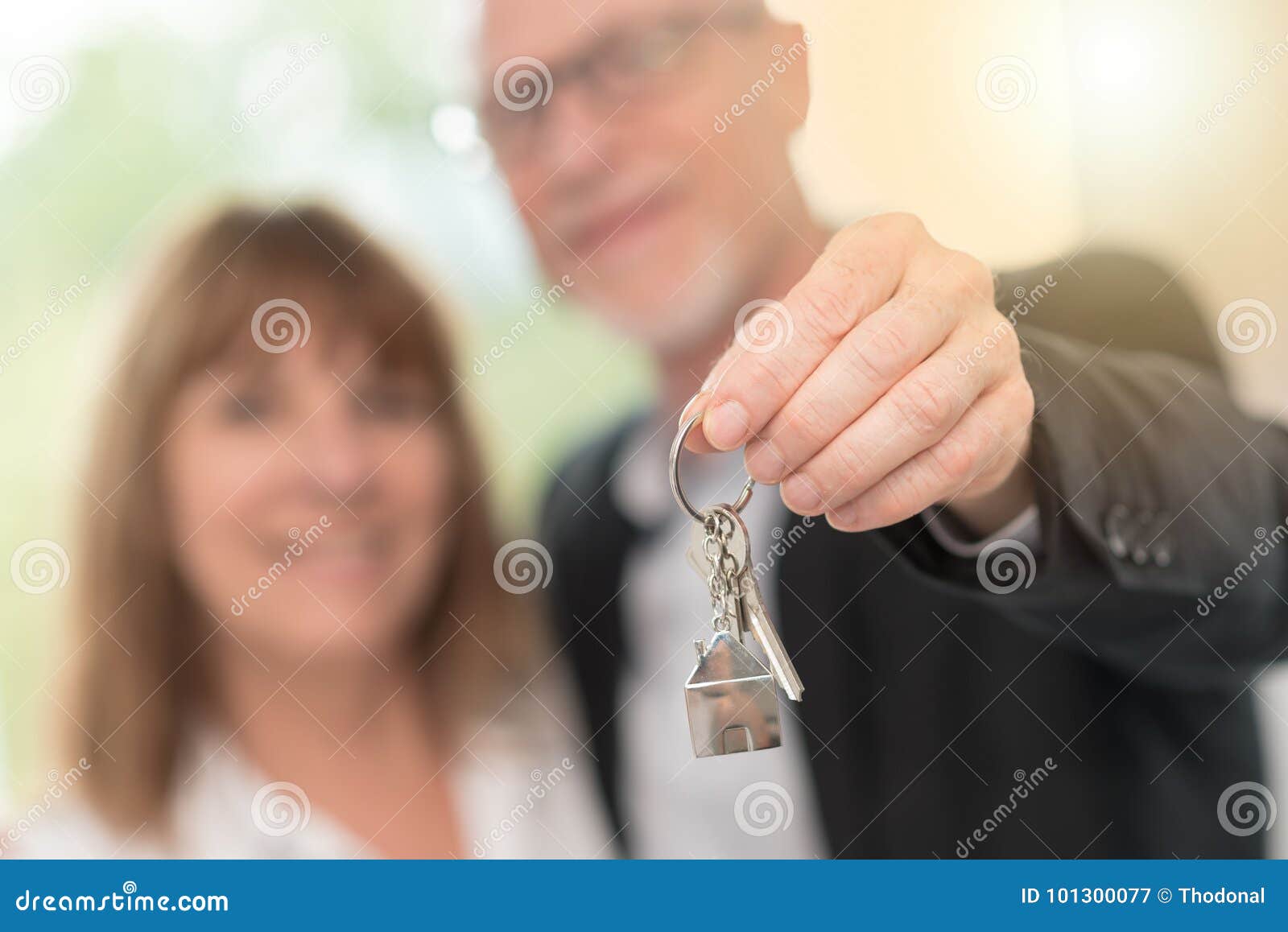 Senior Couple Showing House Keys, Light Effect Stock Image - Image of ...