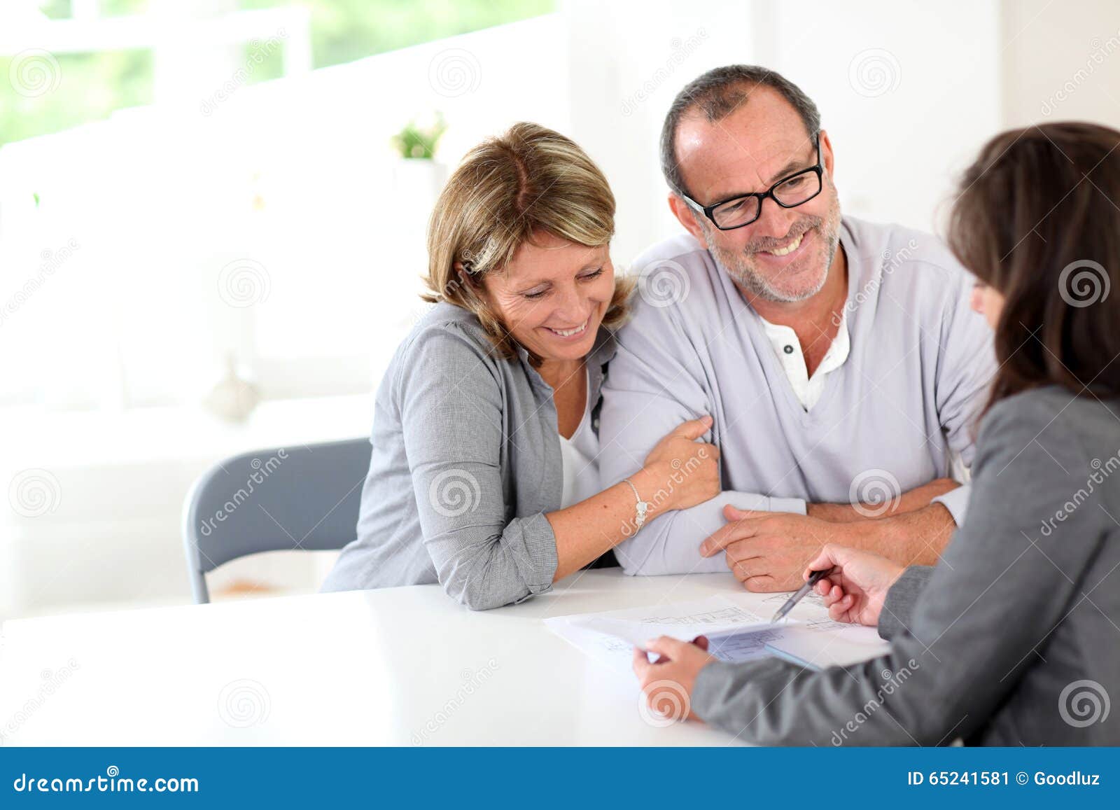 Senior Couple Signing Contract with Financial Advisor Stock Image ...
