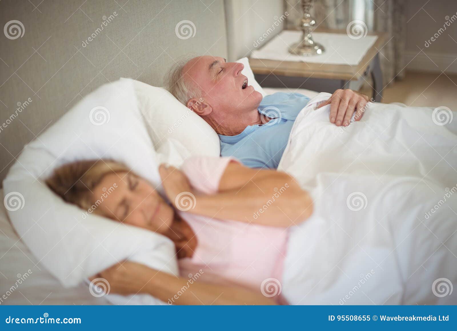 Senior Couple Sleeping on Bed Stock Image - Image of covering, domicile ...