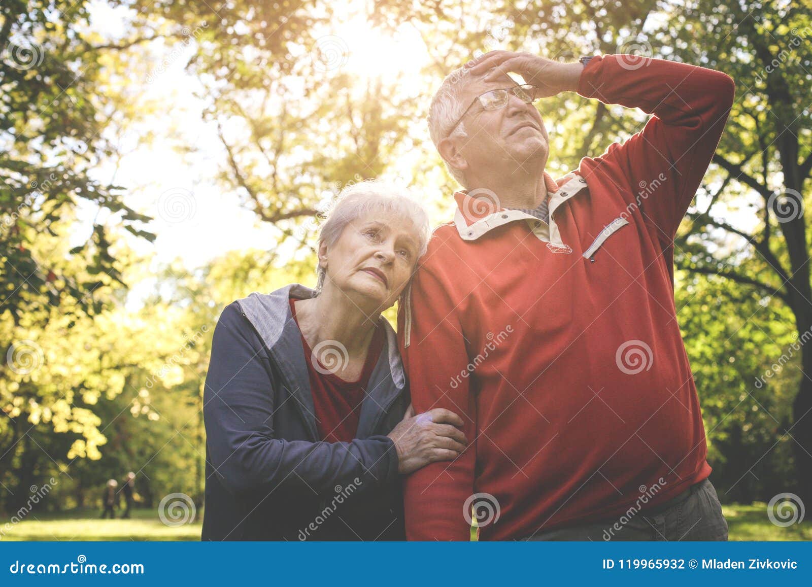 Senior Couple Standing Tired in Park after Exercise. Stock Photo ...