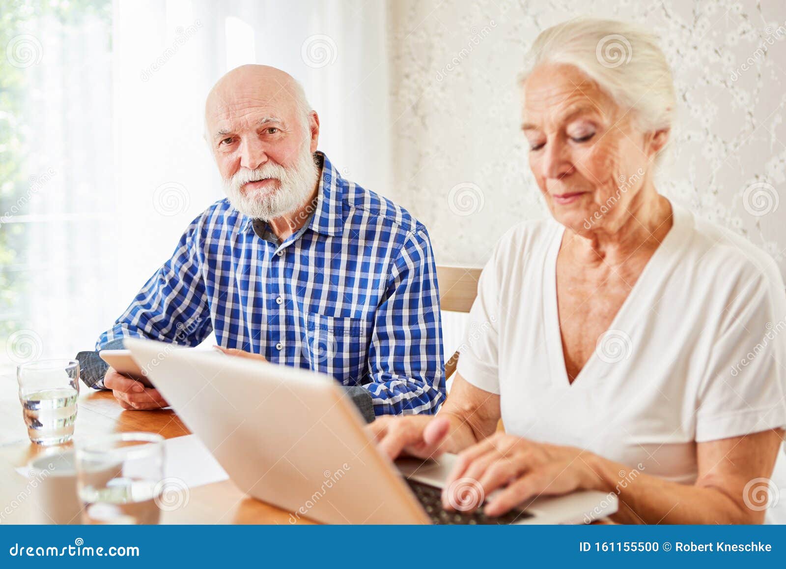 Senior Couple Using E-learning on Laptop Stock Photo - Image of ...